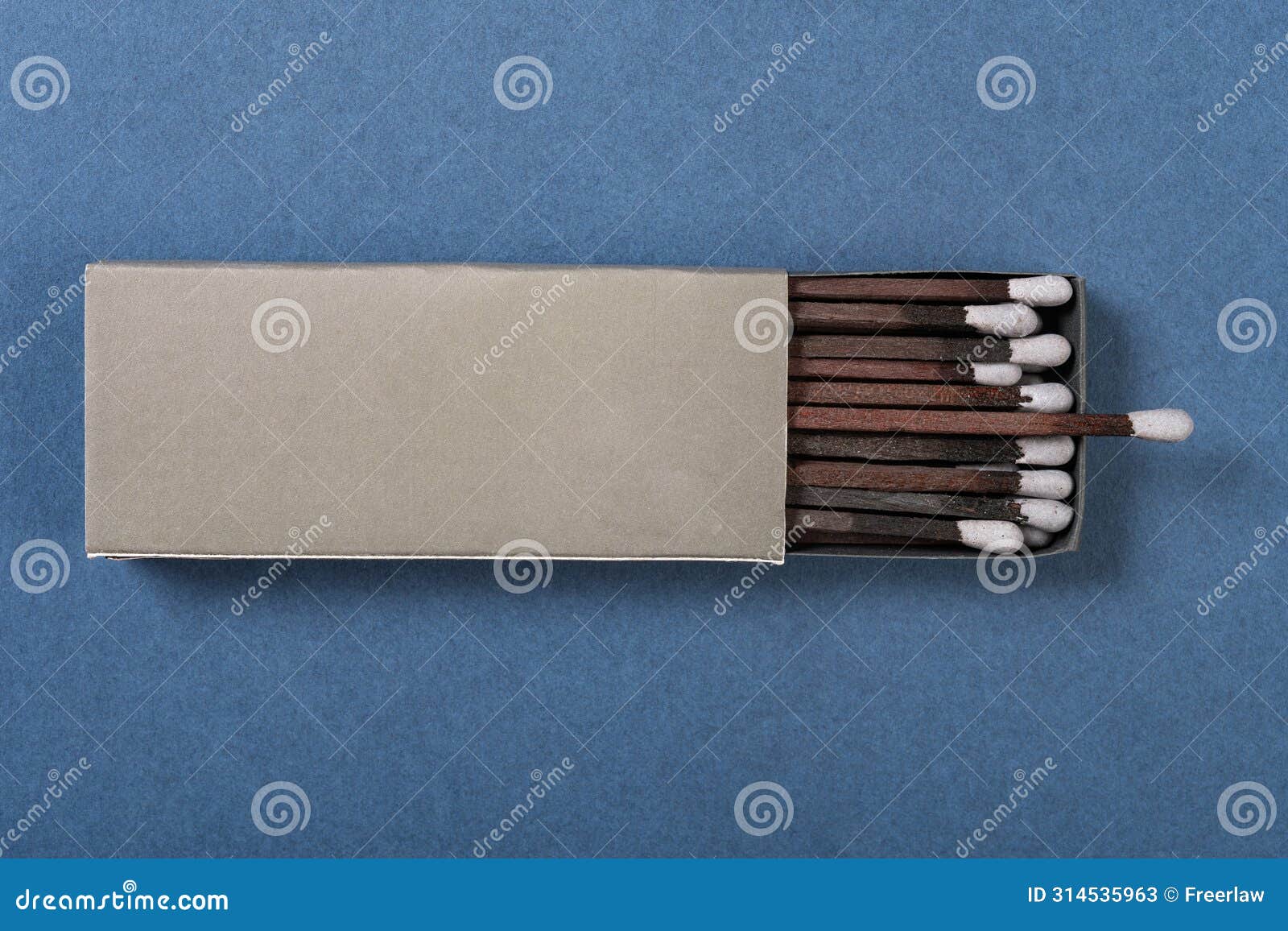 Top View Grey Color Matchbox and Grey Match Sticks on Blue Background ...