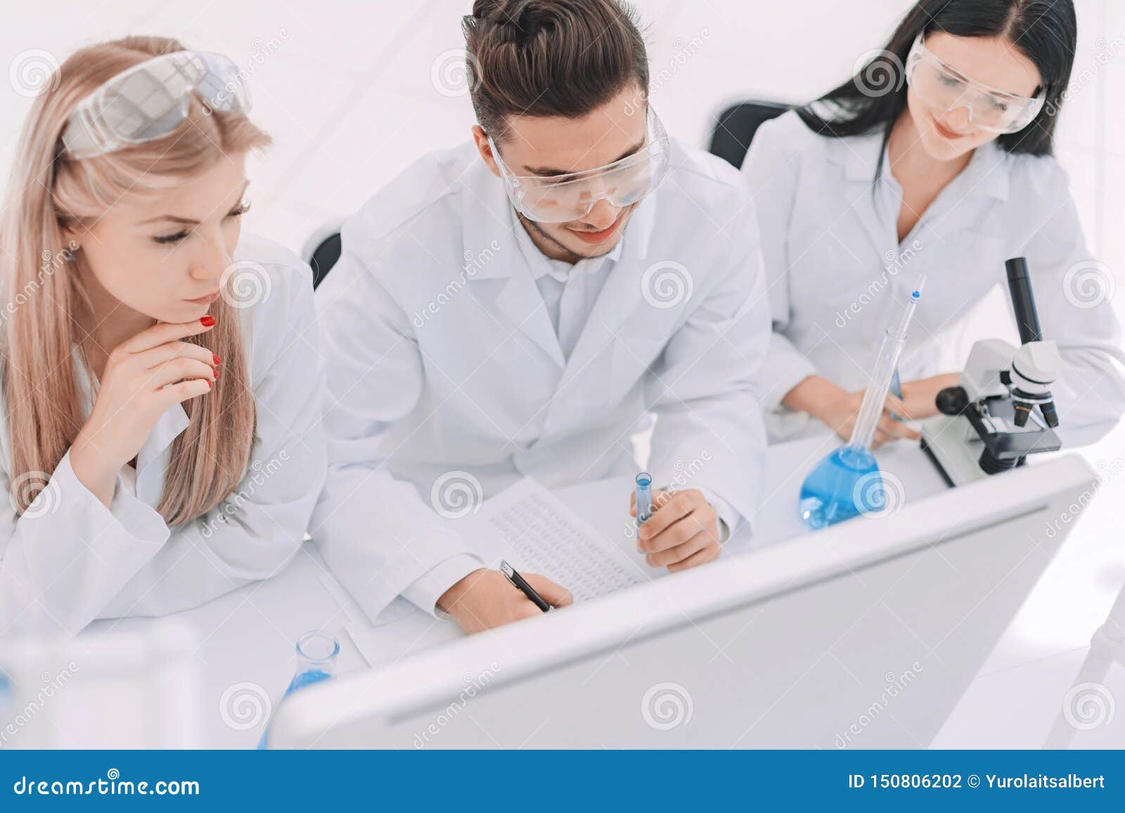 Top View.a Group of Scientists Working on a Computer in the Laboratory ...