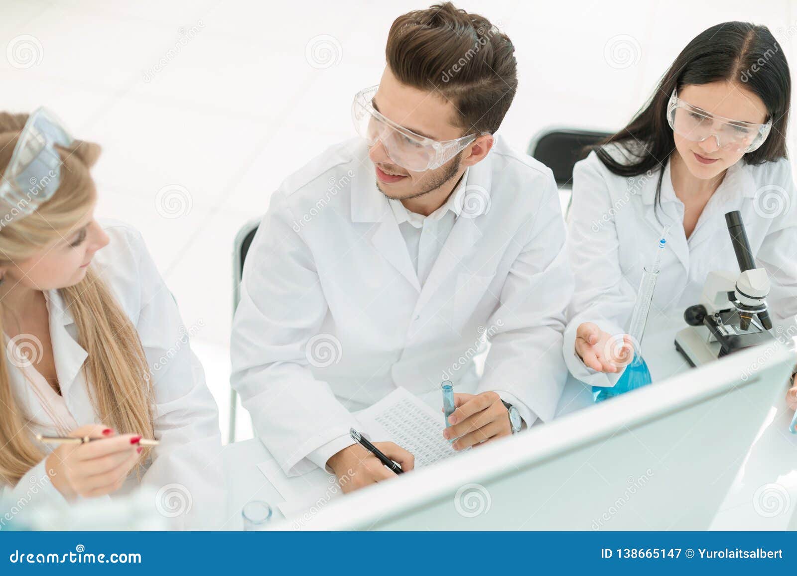 Top View.a Group of Scientists Working on a Computer in the Laboratory ... Top View.a Group of Scientists Working on a Computer in the Laboratory ...