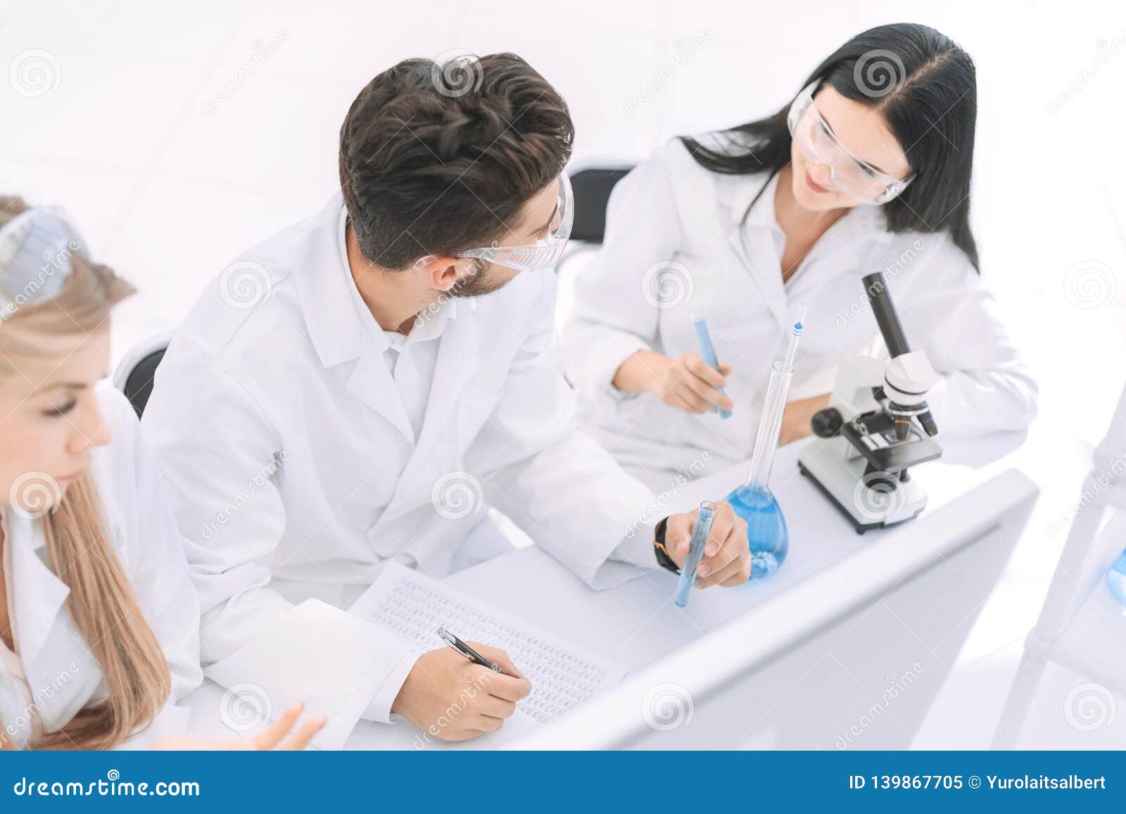 Top View.a Group of Scientists Working on a Computer in the Laboratory ...