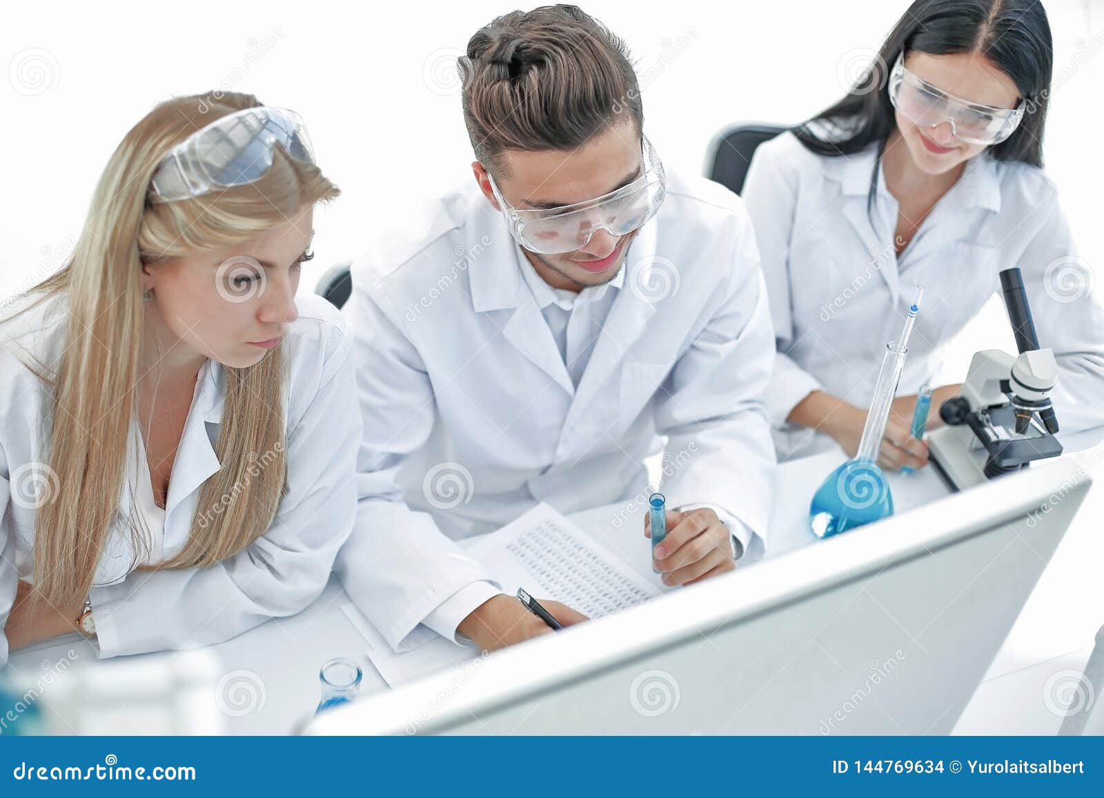 Top View.a Group of Scientists Working on a Computer in the Laboratory ...