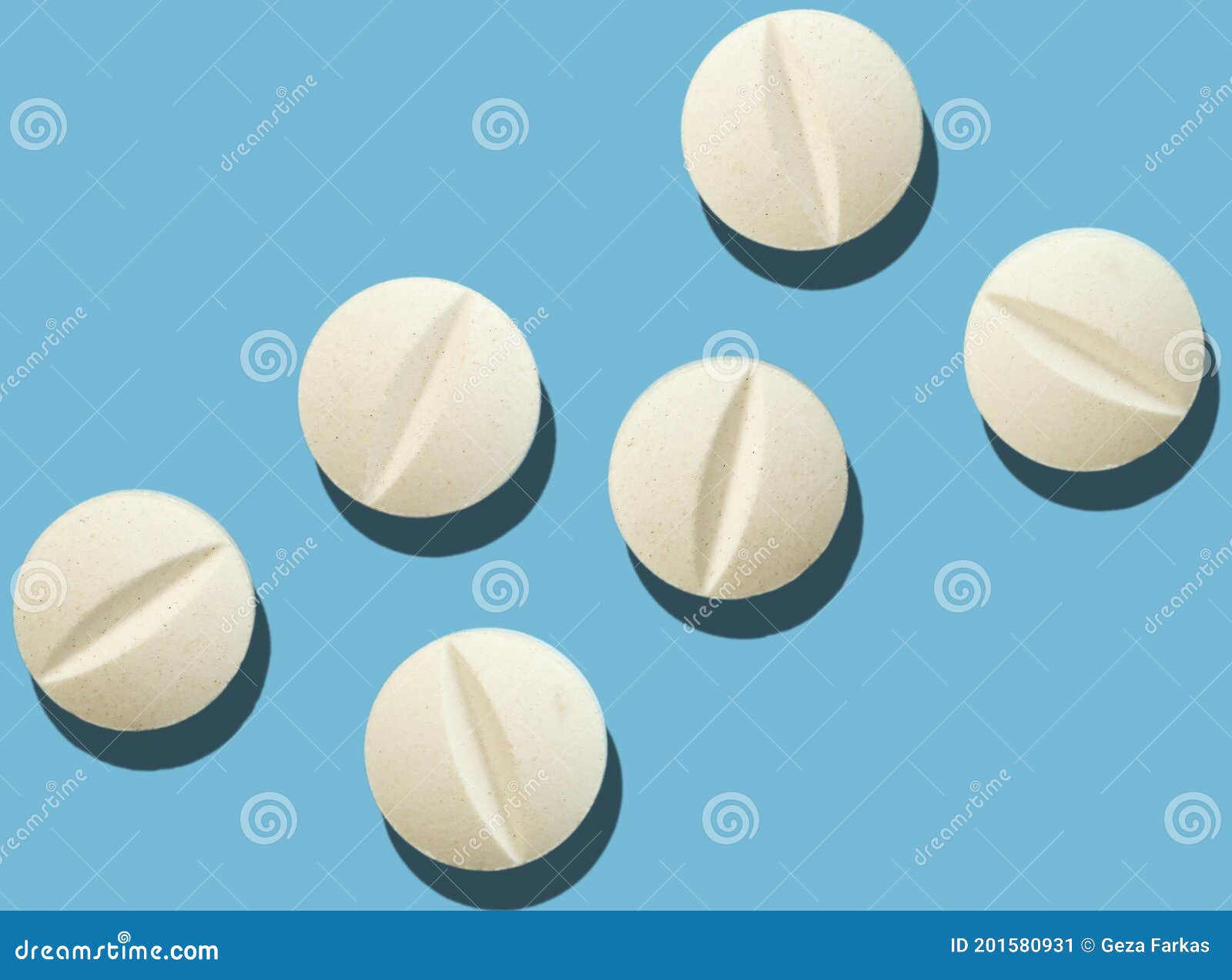 Top View of a Group of Six Pills on a Blue Background Stock Image ...