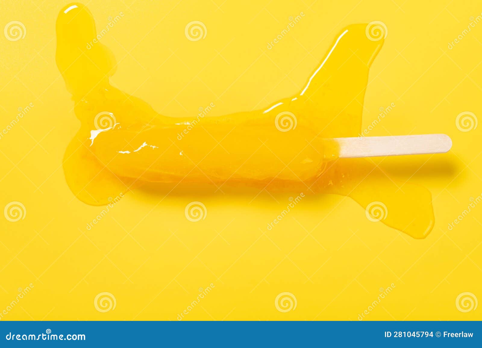 Half Melted Twisted Shaped Pineapple Flavor Popsicle on Yellow ...