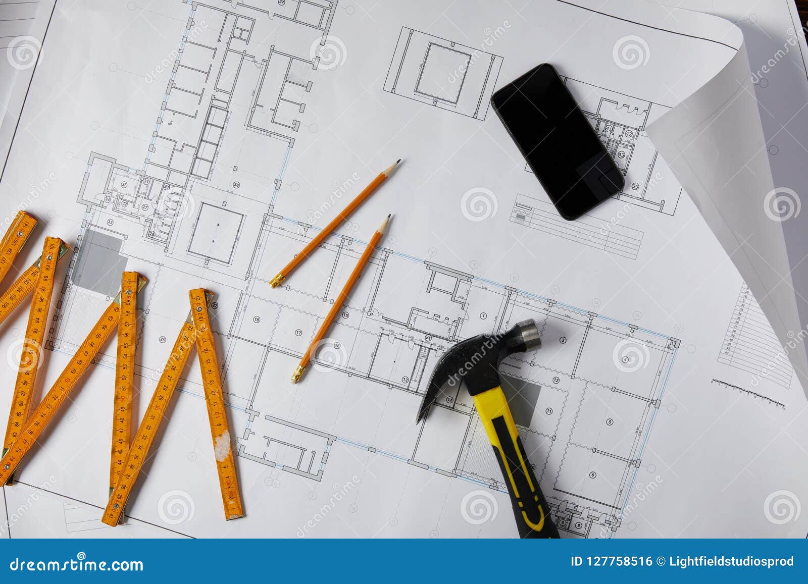 Top View of Hammer, Collapsible Meter, Pencils and Smartphone with ...