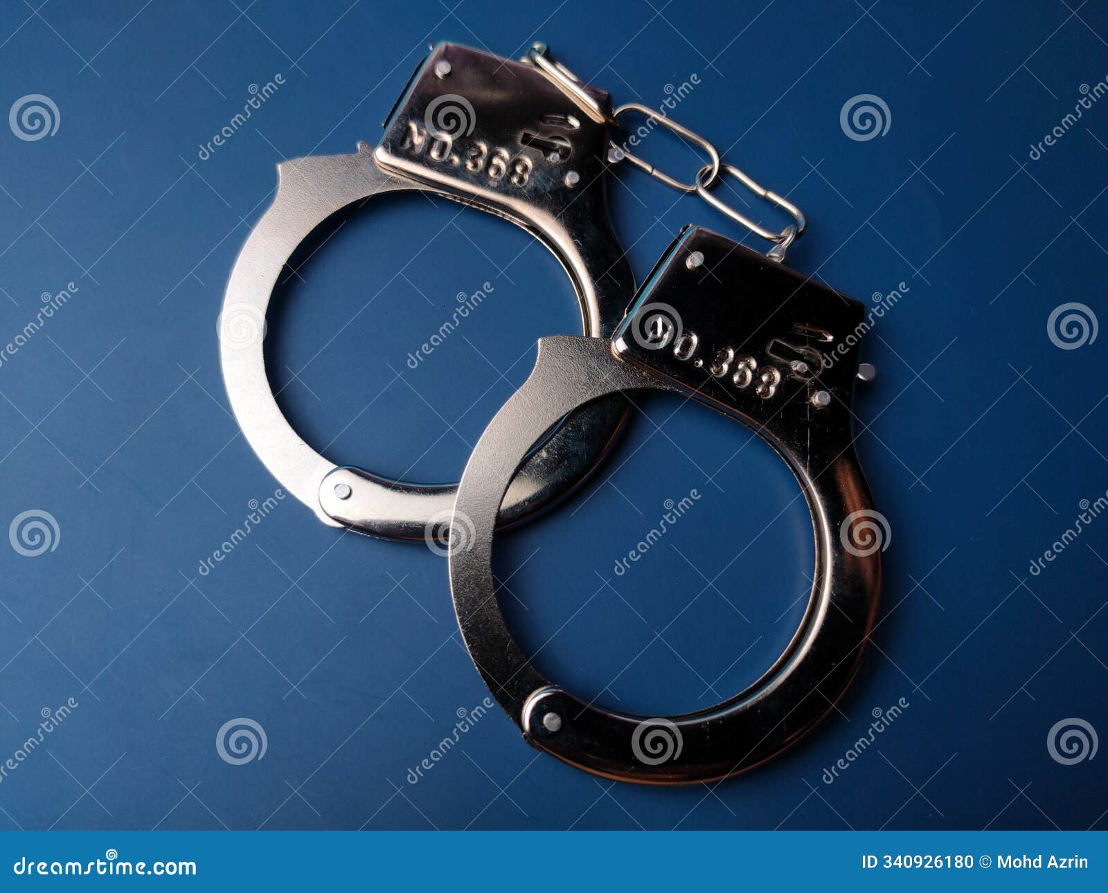 Top View Hand Cuff on a Blue Background Stock Photo - Image of symbol ...