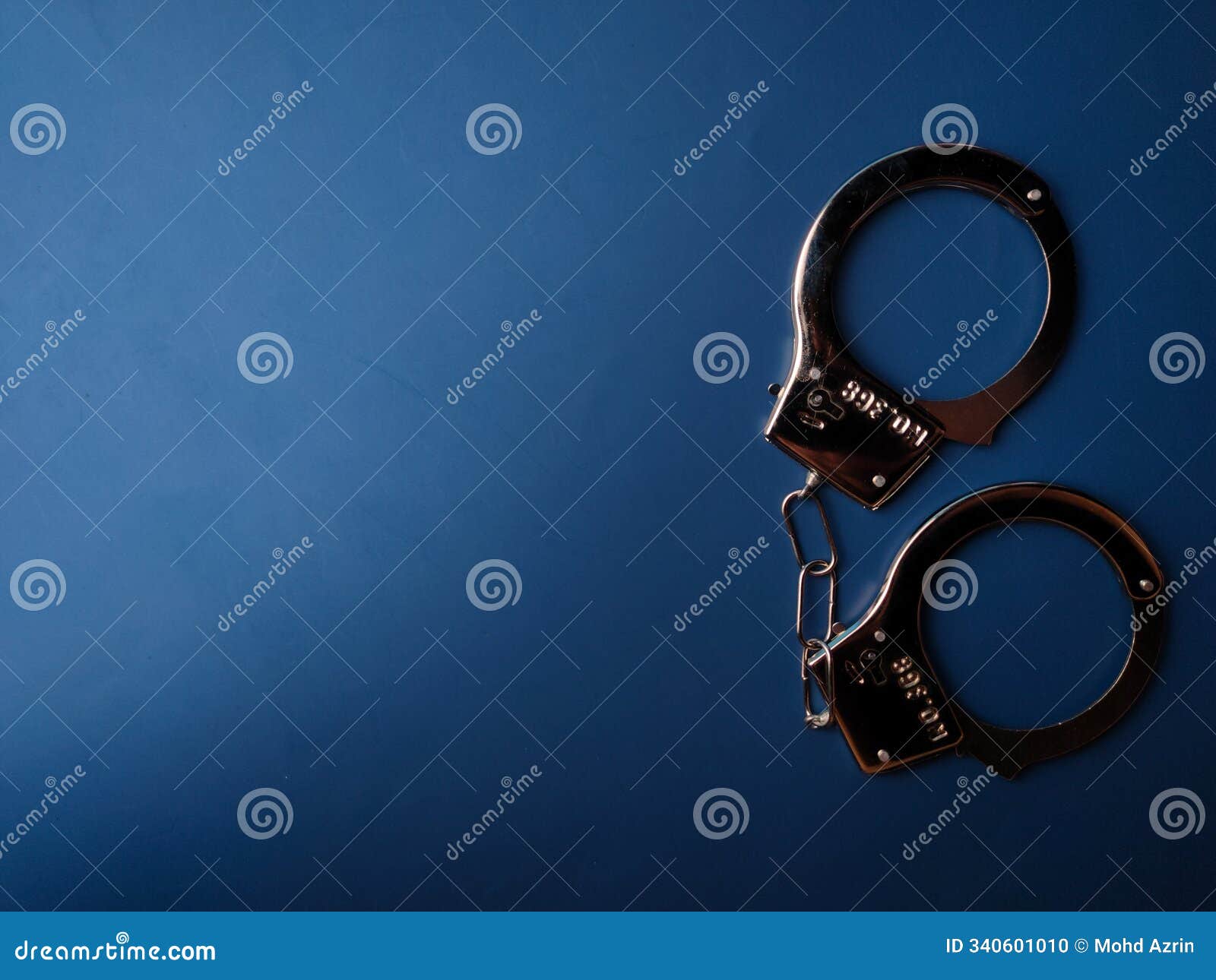 Top View Hand Cuff with Copy and Text Space on a Blue Background Stock ...