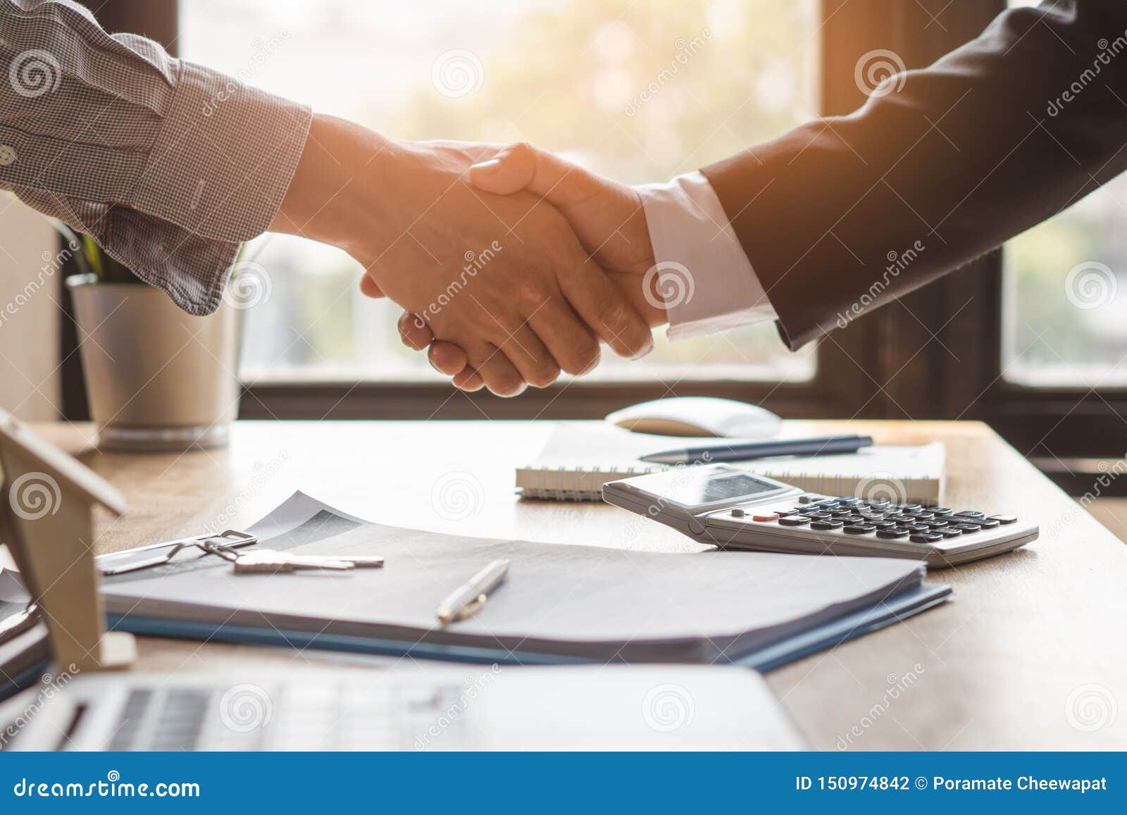 Client Shaking Hands With Contractor After Confirm Blueprint To ...