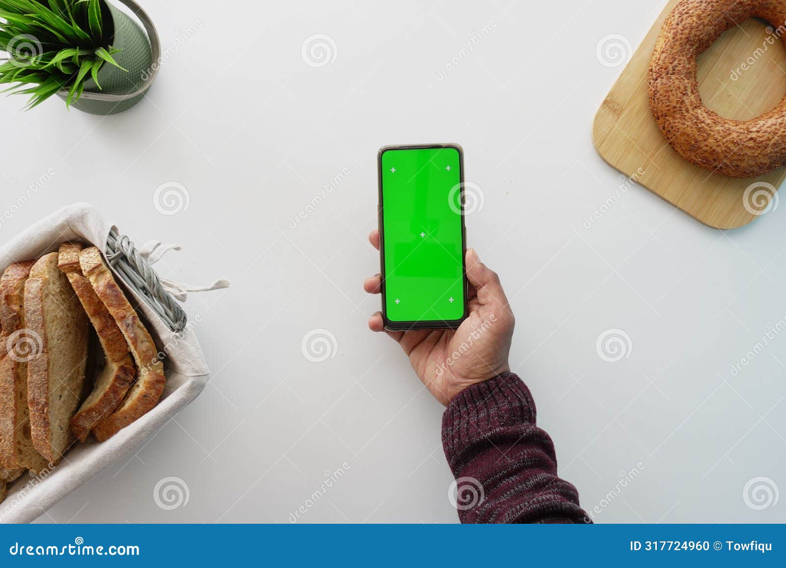 Top View of Holding Smart Phone and Slice of Breads on White Background ...