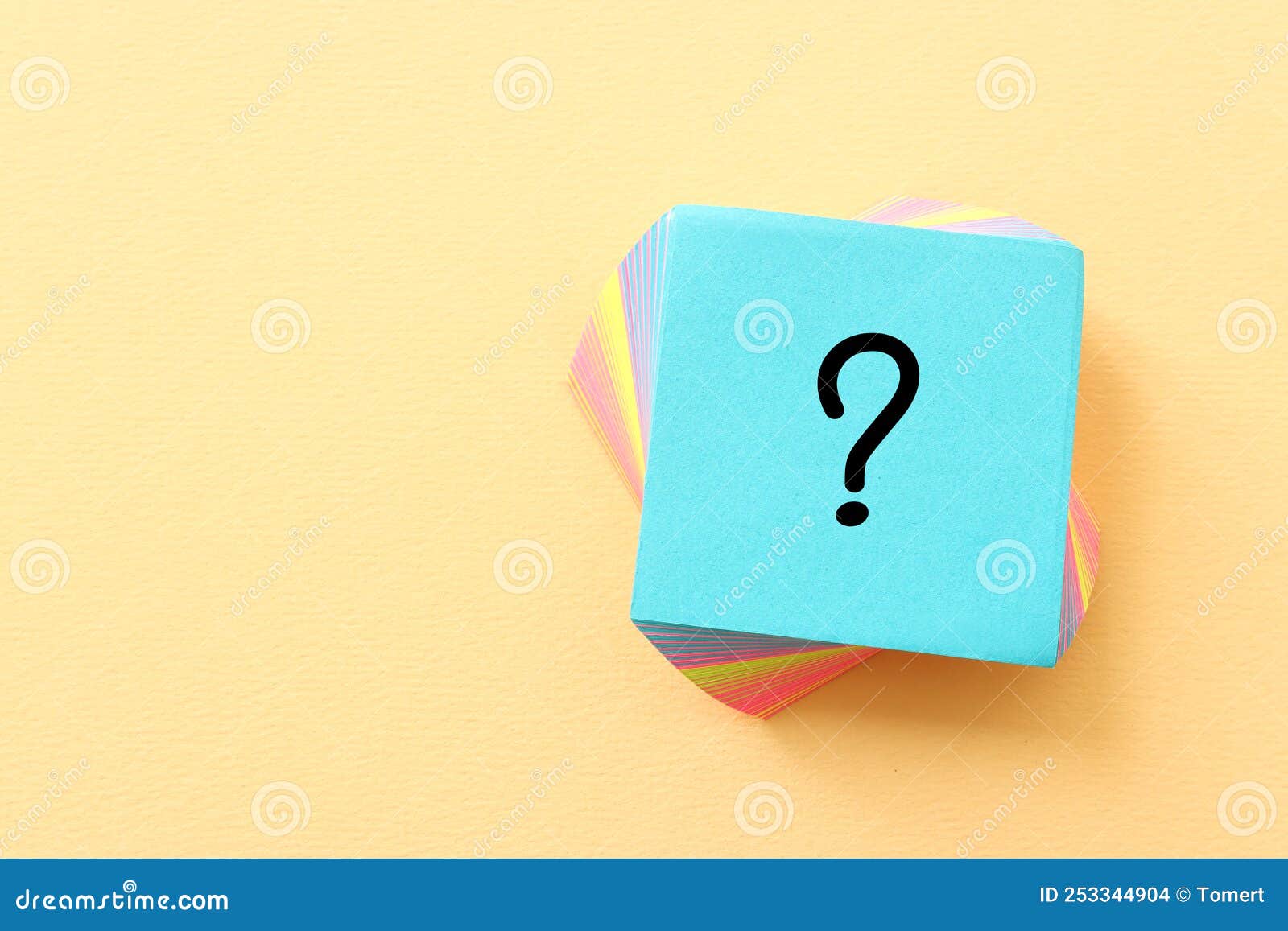 Sticky Note and Question Mark Over Textured Paper Stock Photo - Image ...