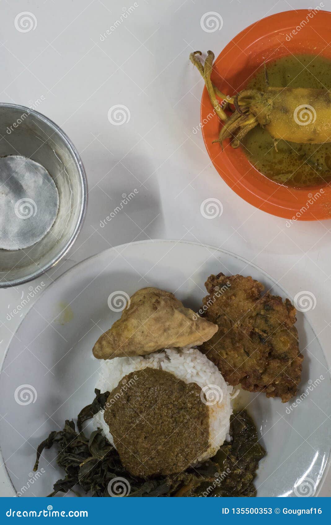 Top View of Indonesian Dish on a White Table with a Hand Washing Bowl ...