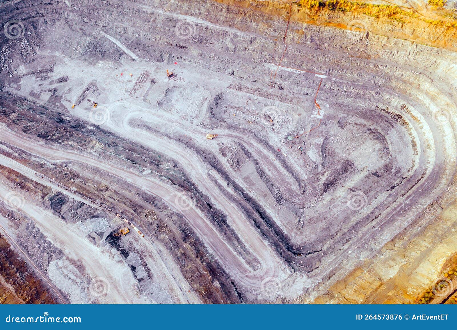 Top View of an Iron Ore Quarry. Excavator Loading Ore into Train Cars ...