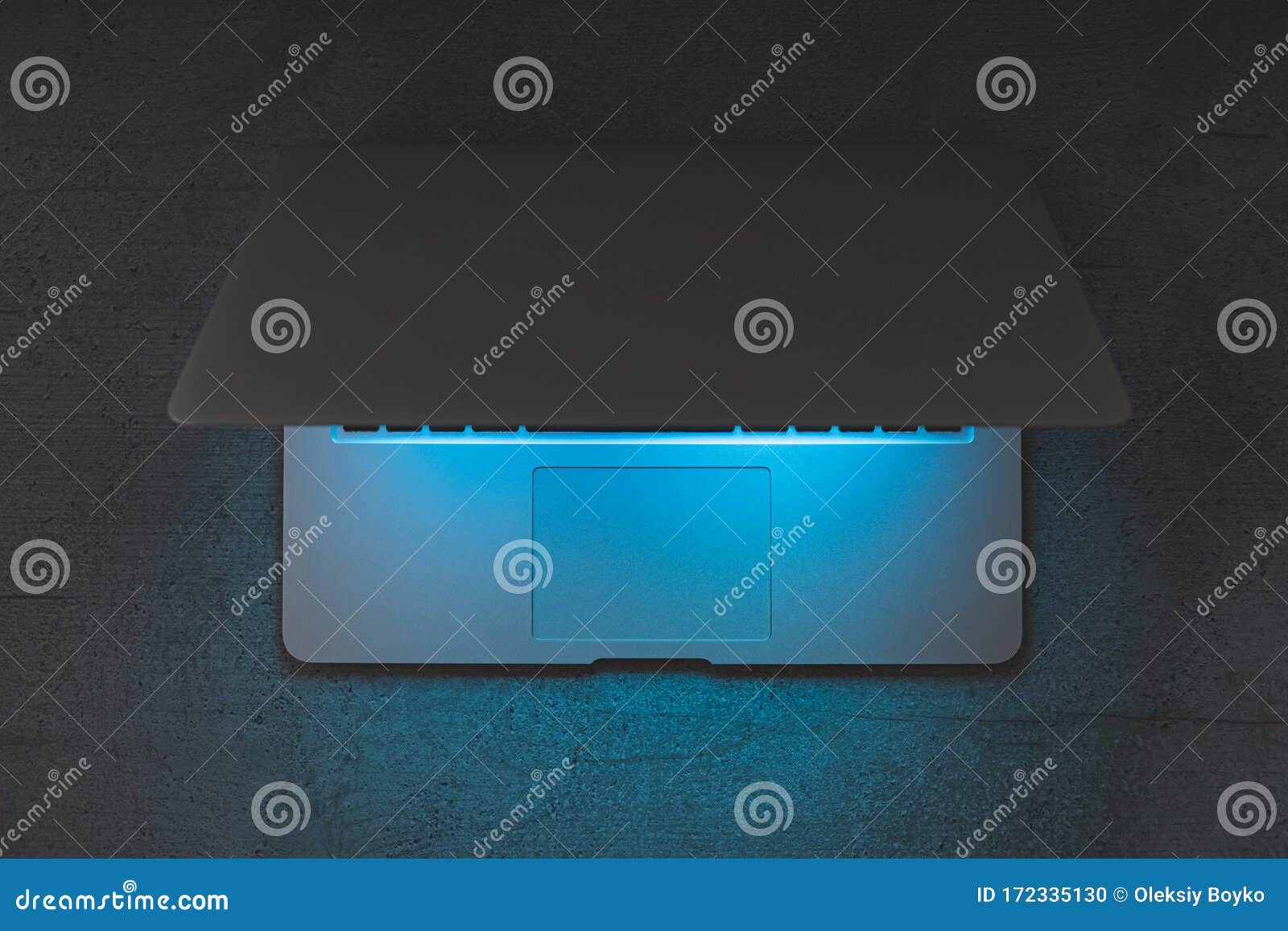 Top View of a Laptop on a Dark Table, Glowing Blue Screen. Stock Photo ...