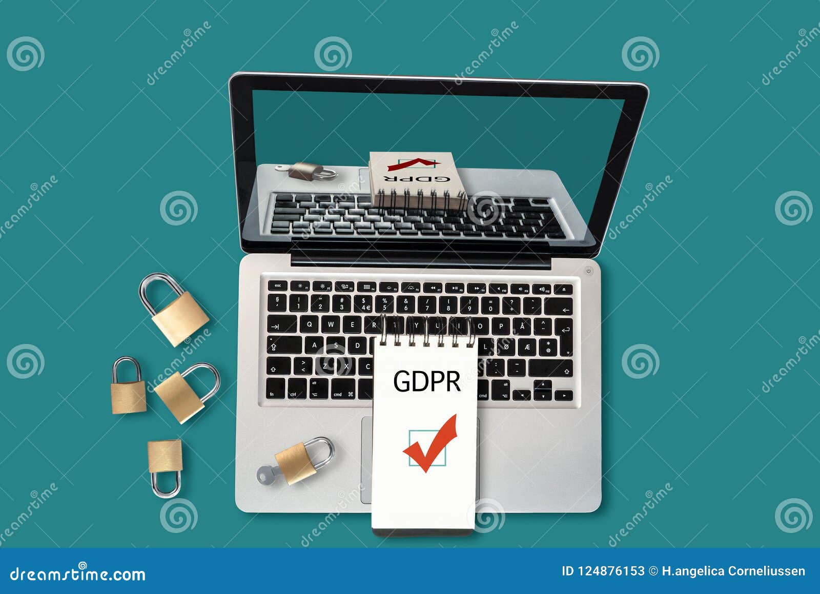 Top View Of A Laptop Padlocks And A Notepad With Text Gdpr And A Ticked Checkbox On It