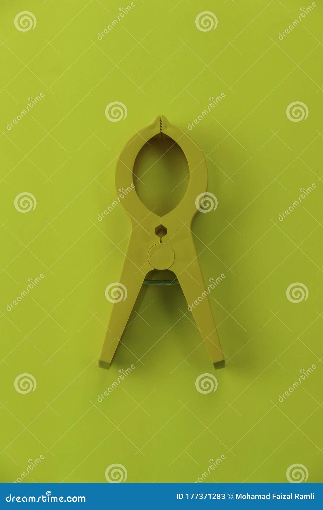 Top View of a Large Yellow Plastic Clothes Pin on a Yellow Background ...