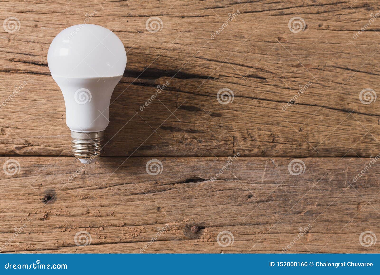 Top View of Light Bulb on Wood Background and Copy Space Stock Photo ...