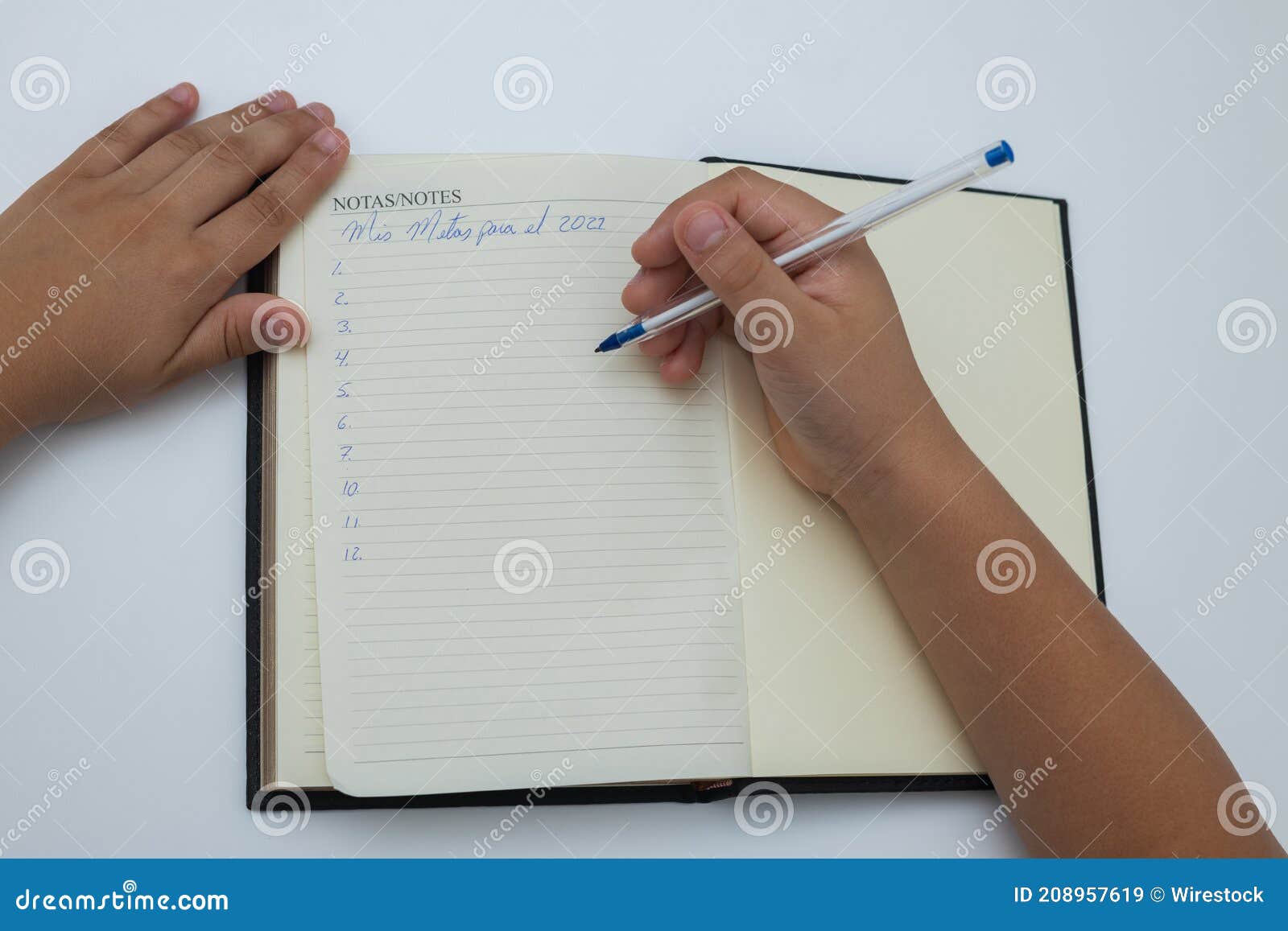 Top View of Little Boy Hands Writing Down Notes in His Notebook Stock ...