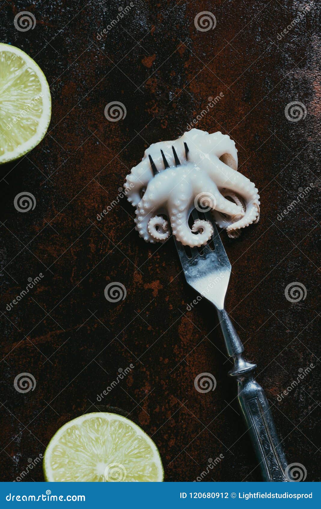Top View of Little Octopus on Fork on Rusty Metal Surface Stock Photo ...