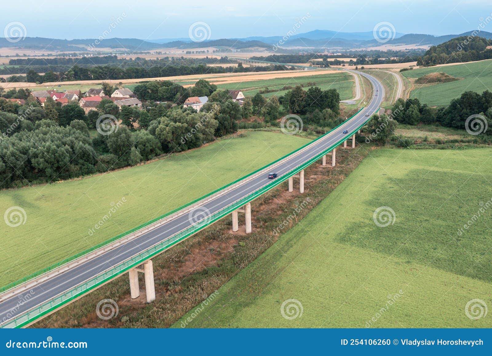 Top View of a Long Bridge Passing through Green Fields Stock Photo ...