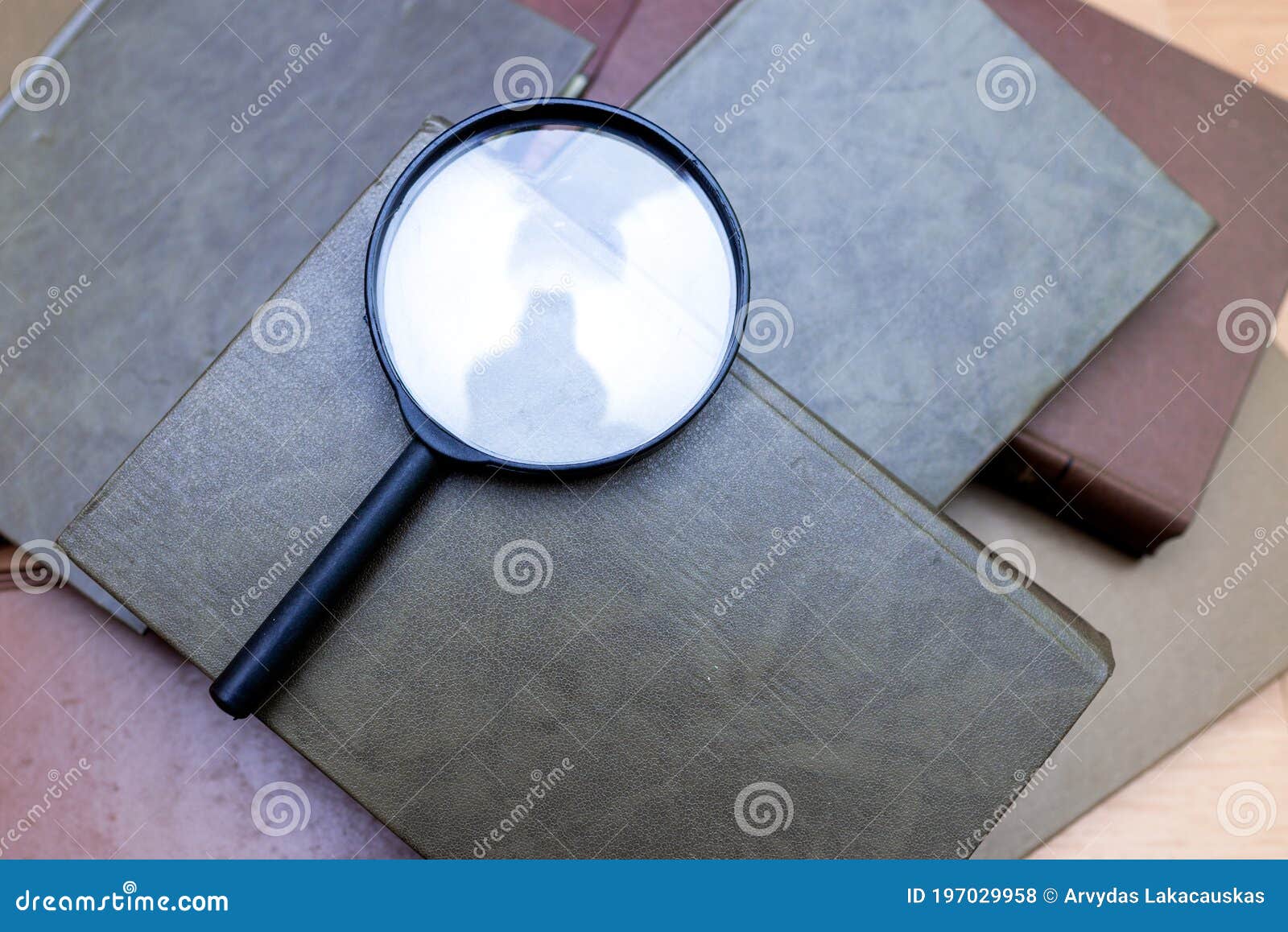 Top View Magnifying Glass a Few Closed Books on a Brown Table Stock ...