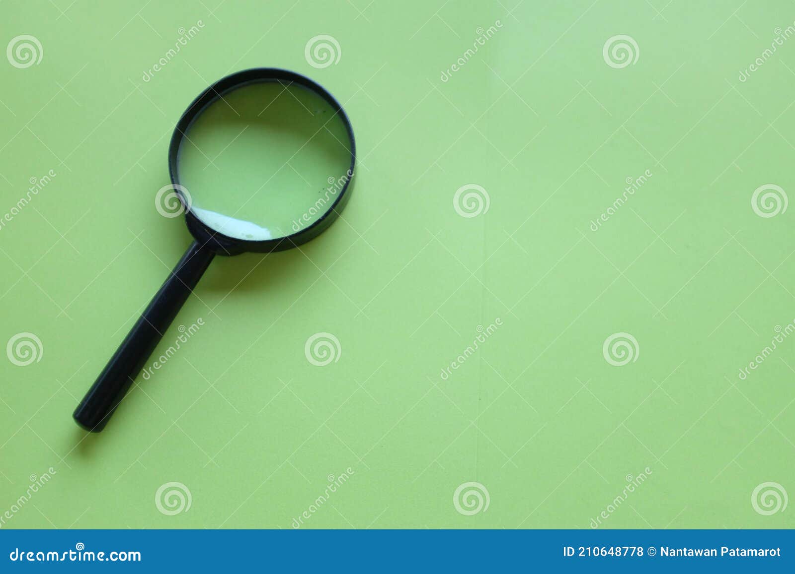 Top View Magnifying Glass Isolate on a Green Background Stock Photo ...