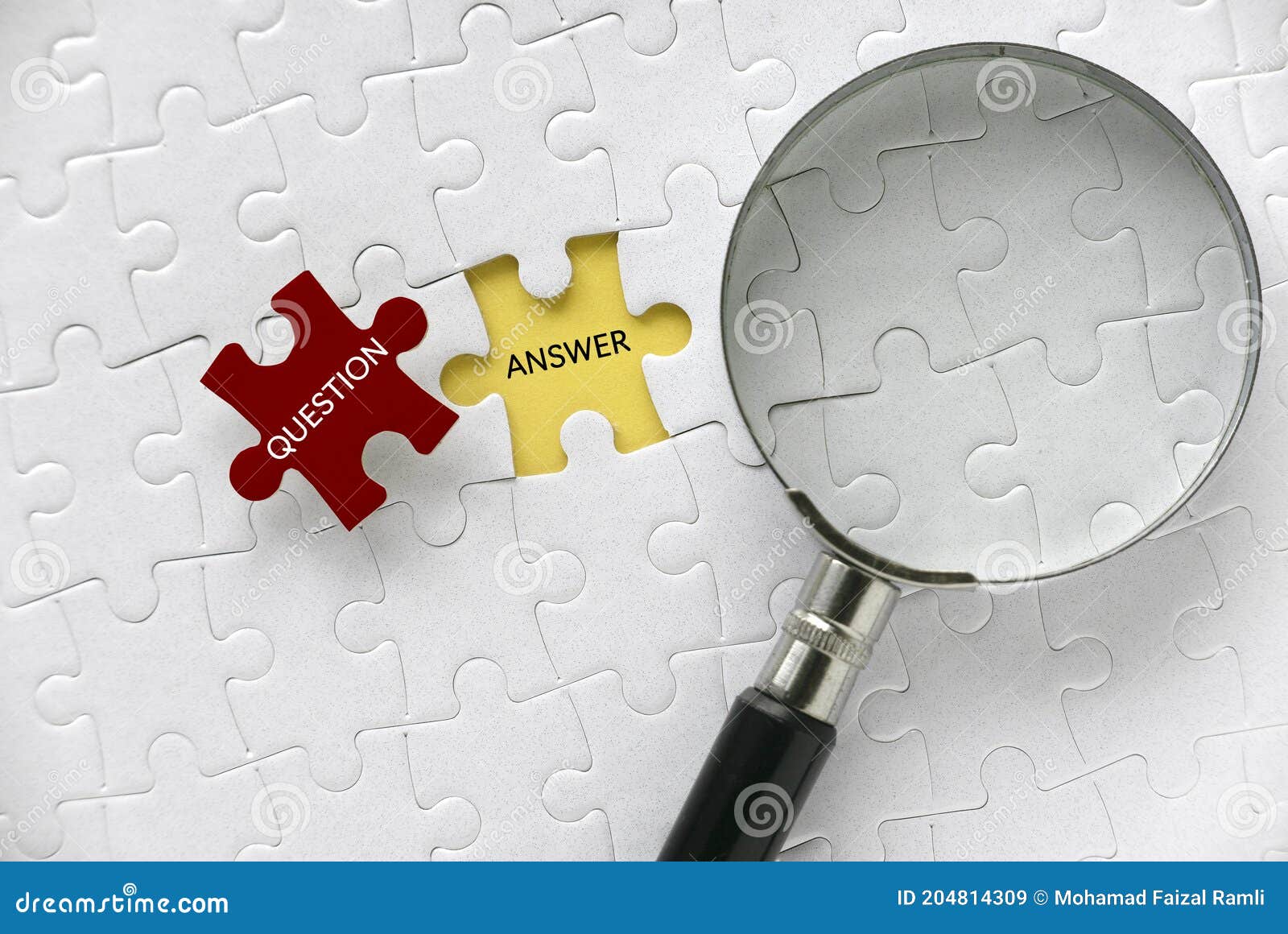 Top View of Magnifying Glass, and a Jigsaw Puzzle Written with Question ...