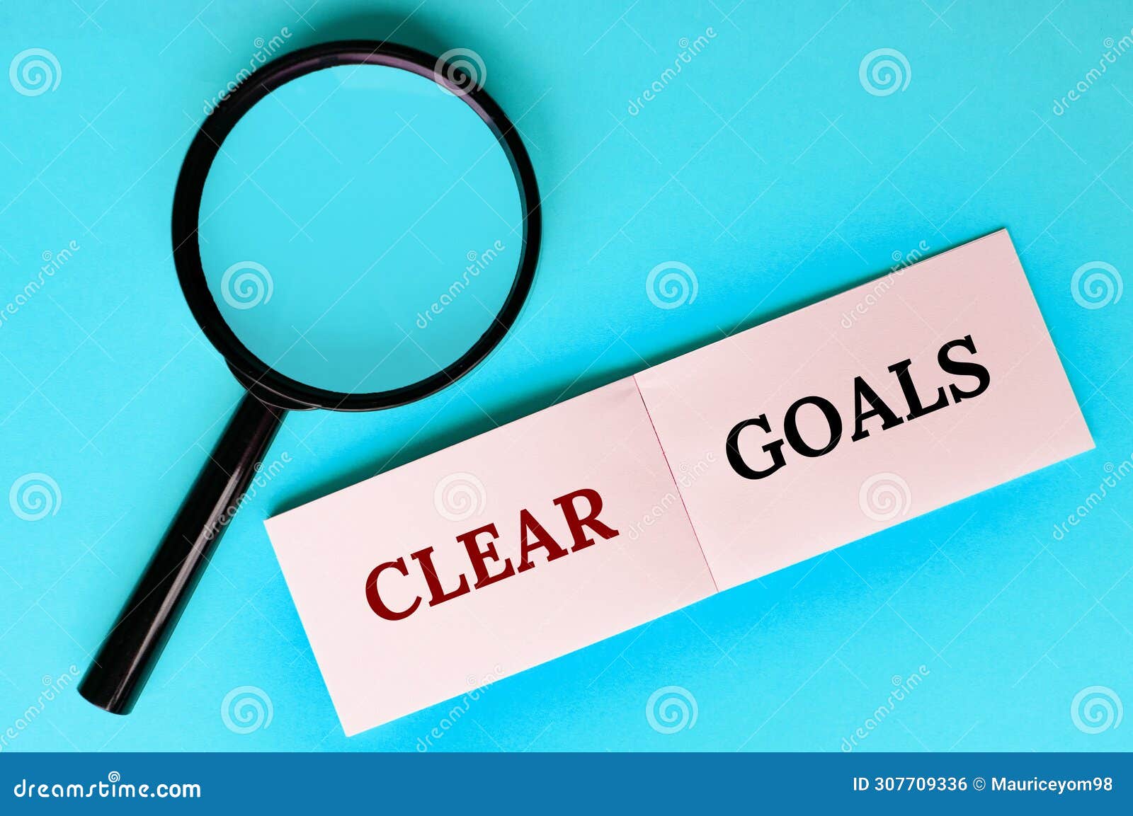 Top View Of Magnifying Glass And Notepad With Clear Goals Text On Light ...