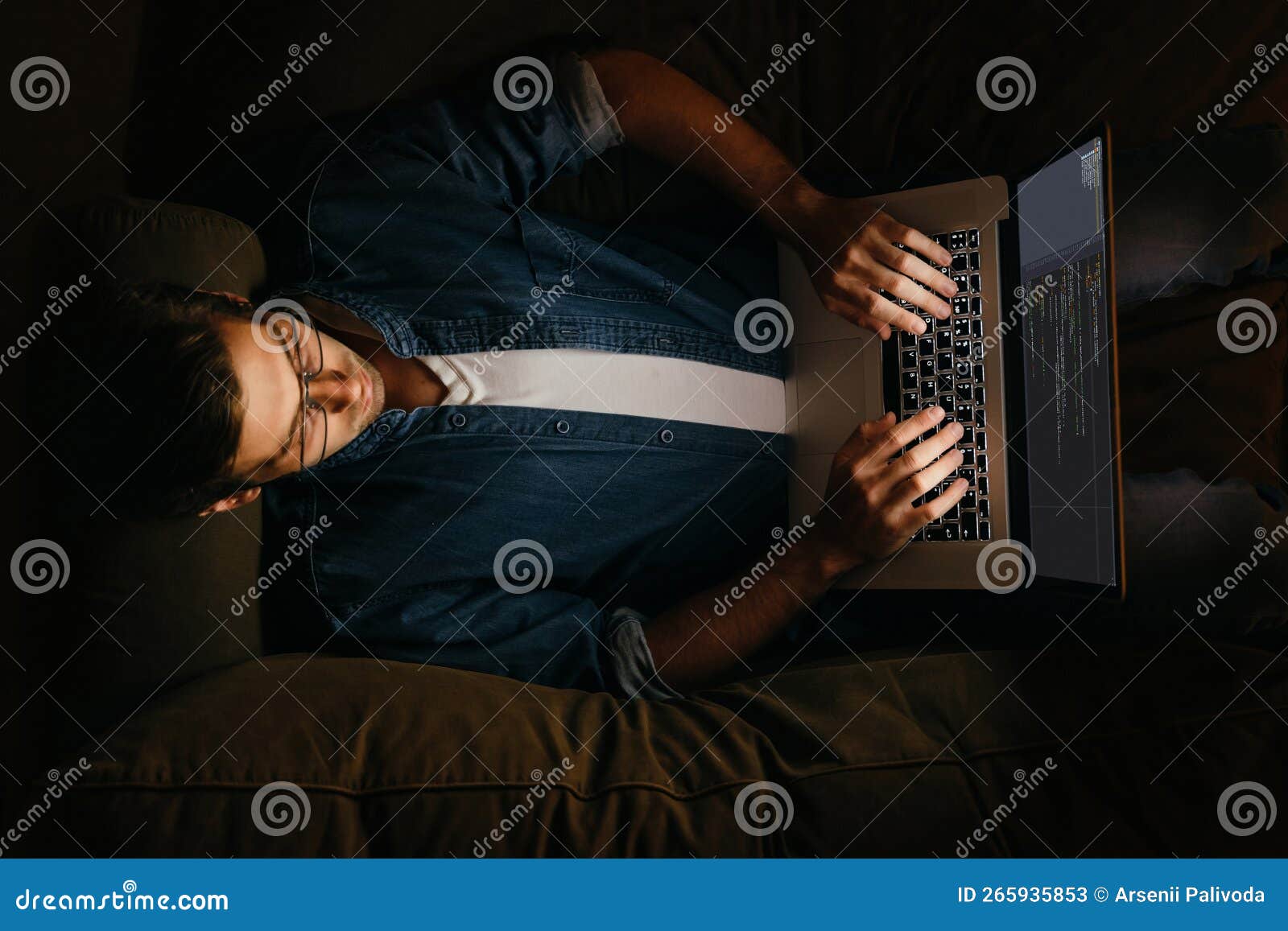 Programmer Laying on Sofa and Working at His Laptop Stock Image - Image ...