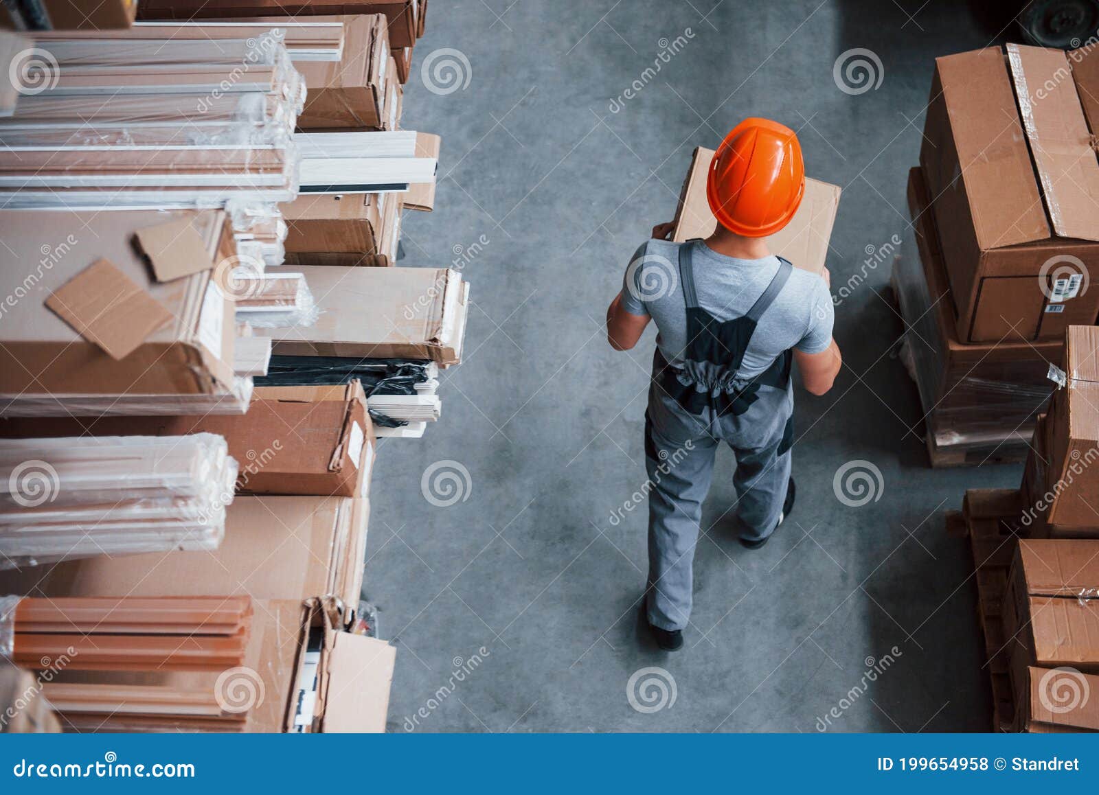 Top View of Male Worker in Warehouse with Box in Hands Stock Photo ...