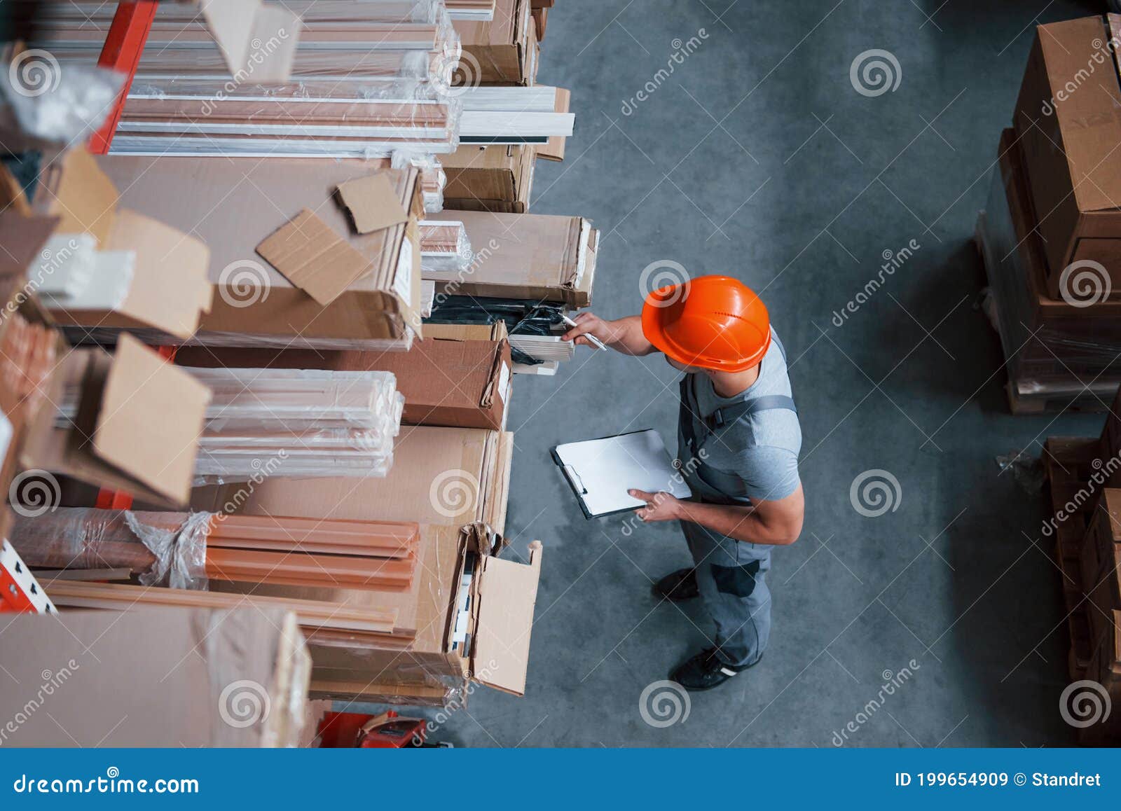 Top View of Male Worker in Warehouse with Notepad in Hands Stock Image ...