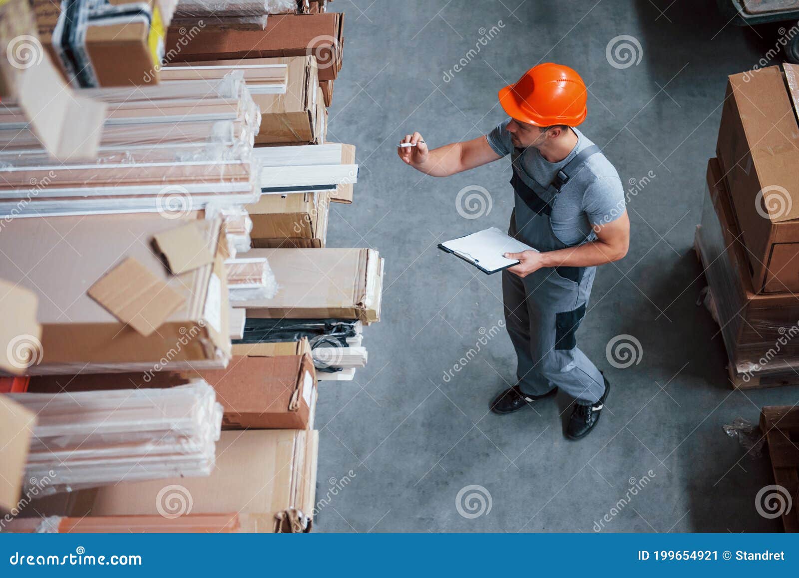 Top View of Male Worker in Warehouse with Notepad in Hands Stock Image ...