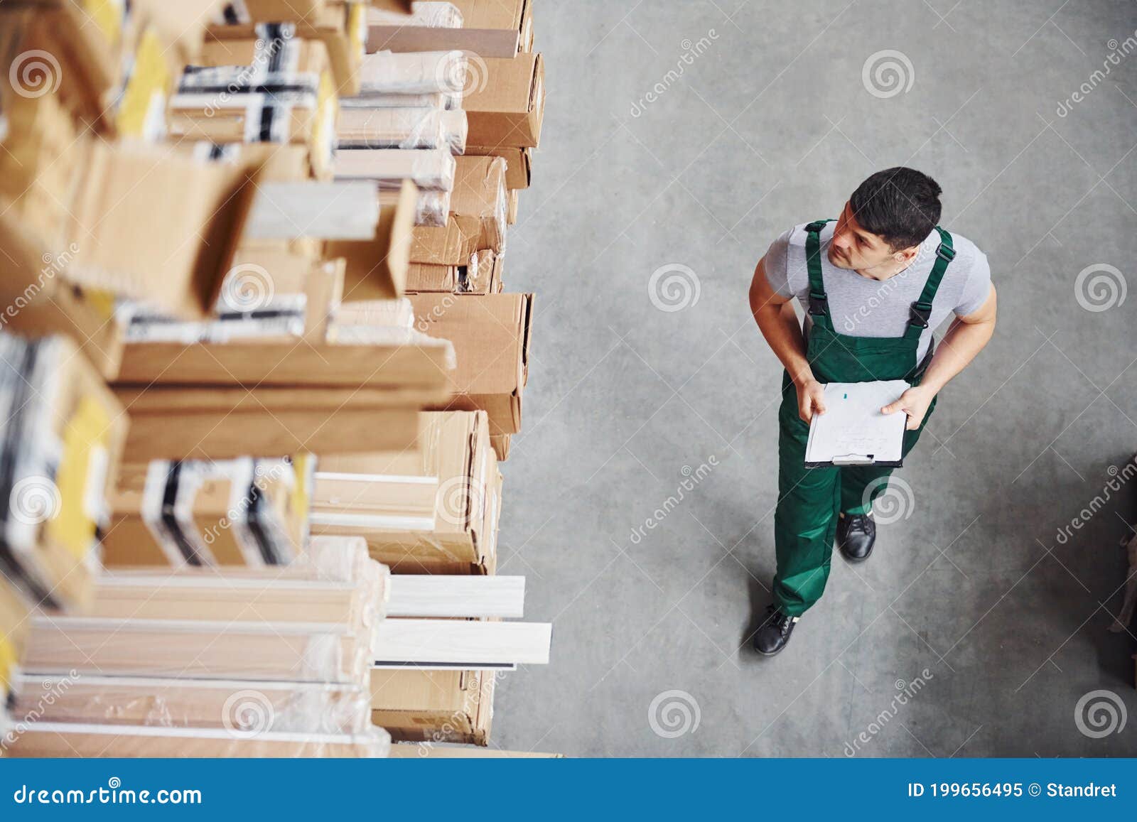 Top View of Male Worker in Warehouse with Notepad in Hands Stock Image ...