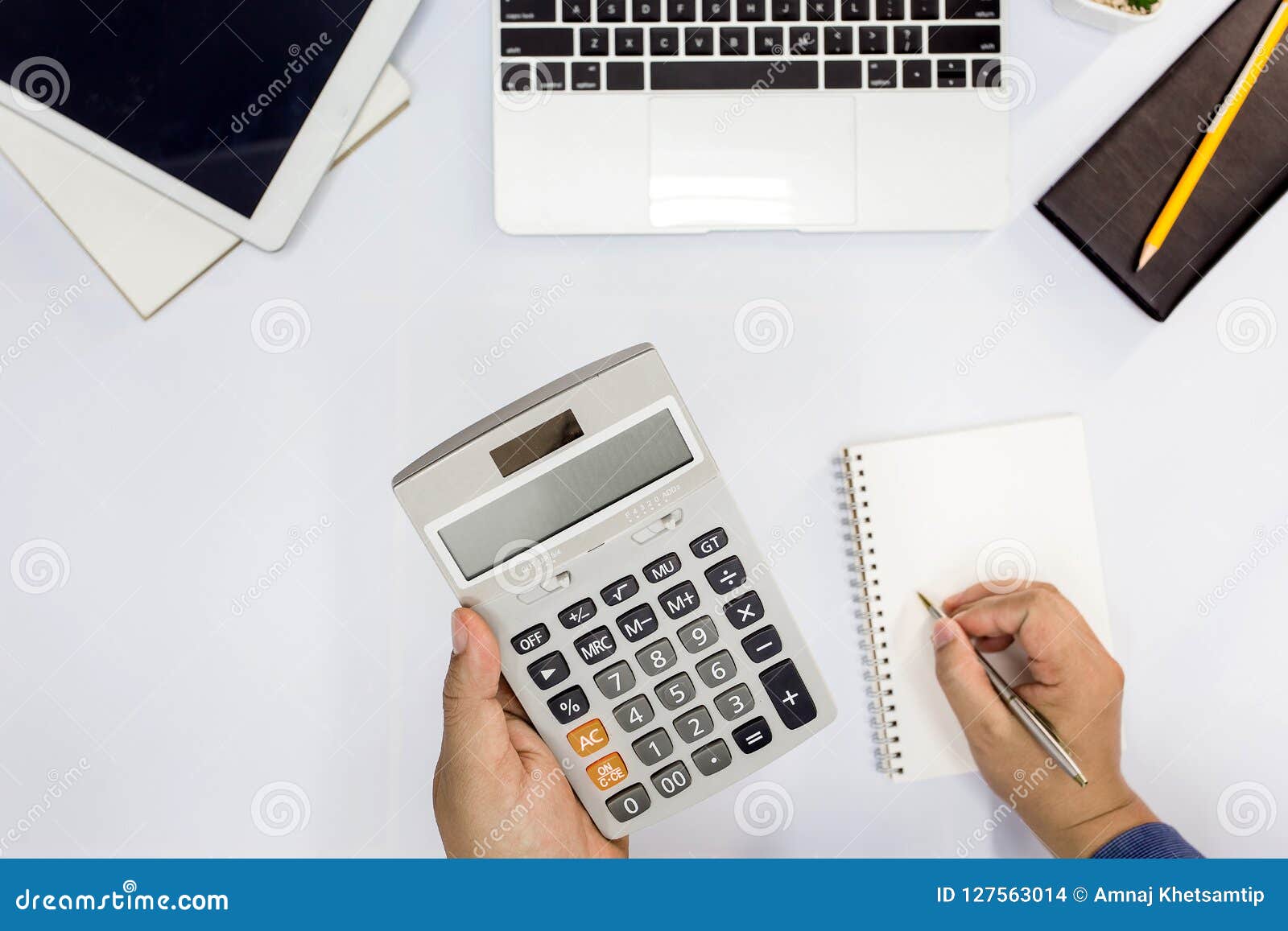 Top View. Man Using Calculator and Writing Make Note. Stock Photo ...