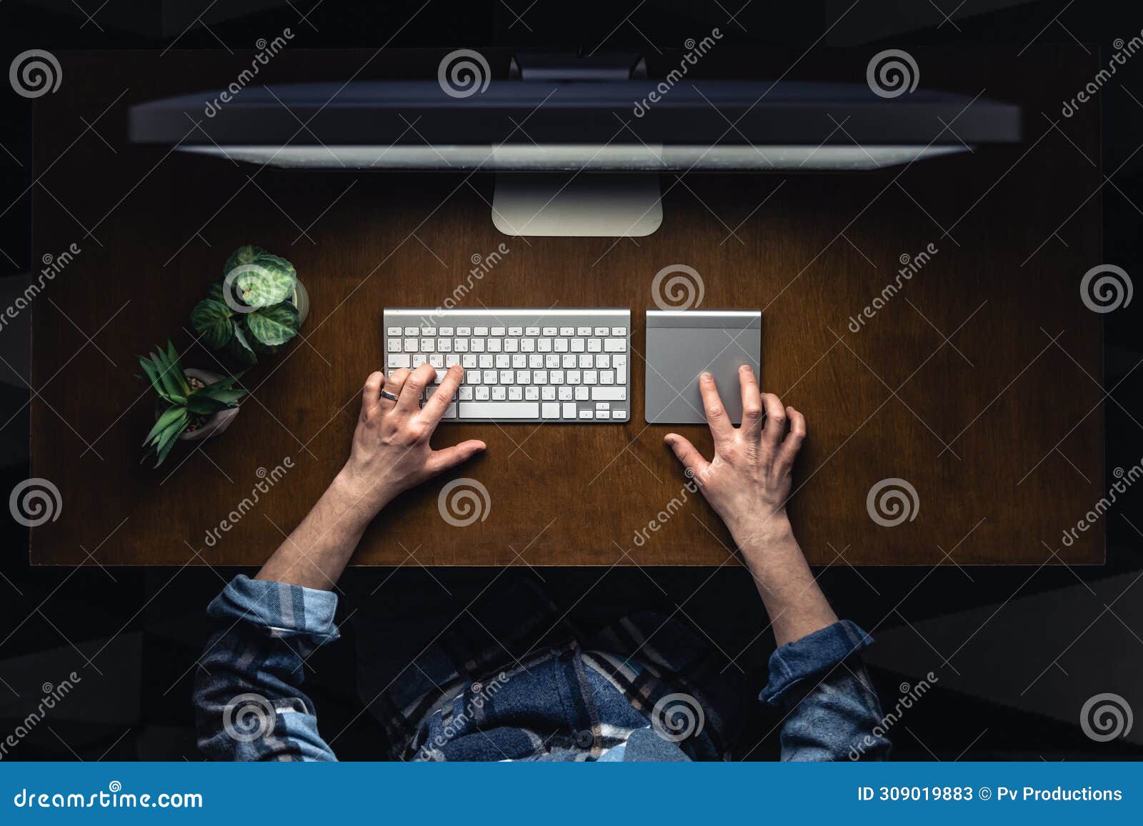 Top View of a Man Working at a Computer in a Dark Room at Night. Stock ...