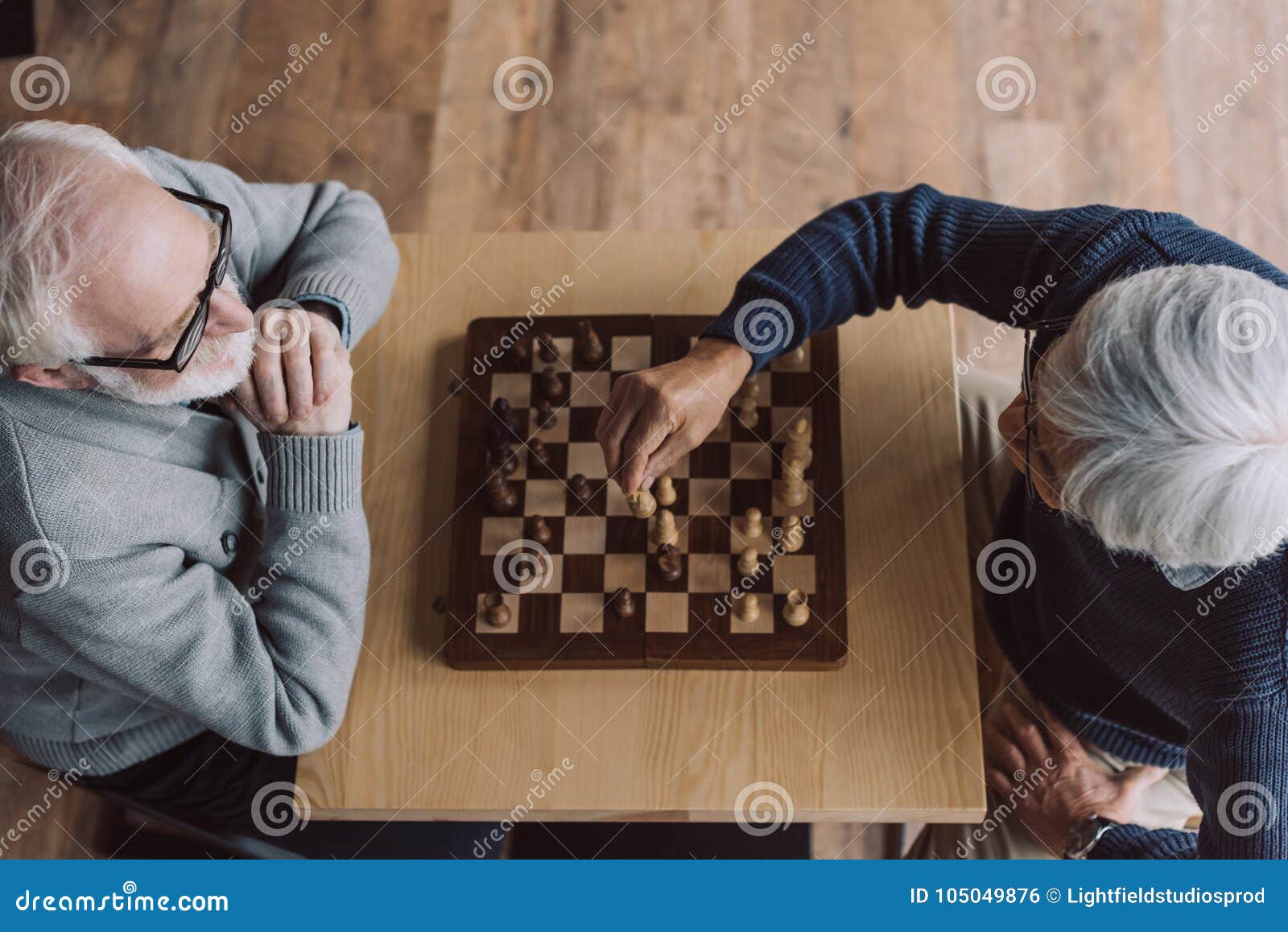 Senior men playing chess stock photo. Image of board - 105049876