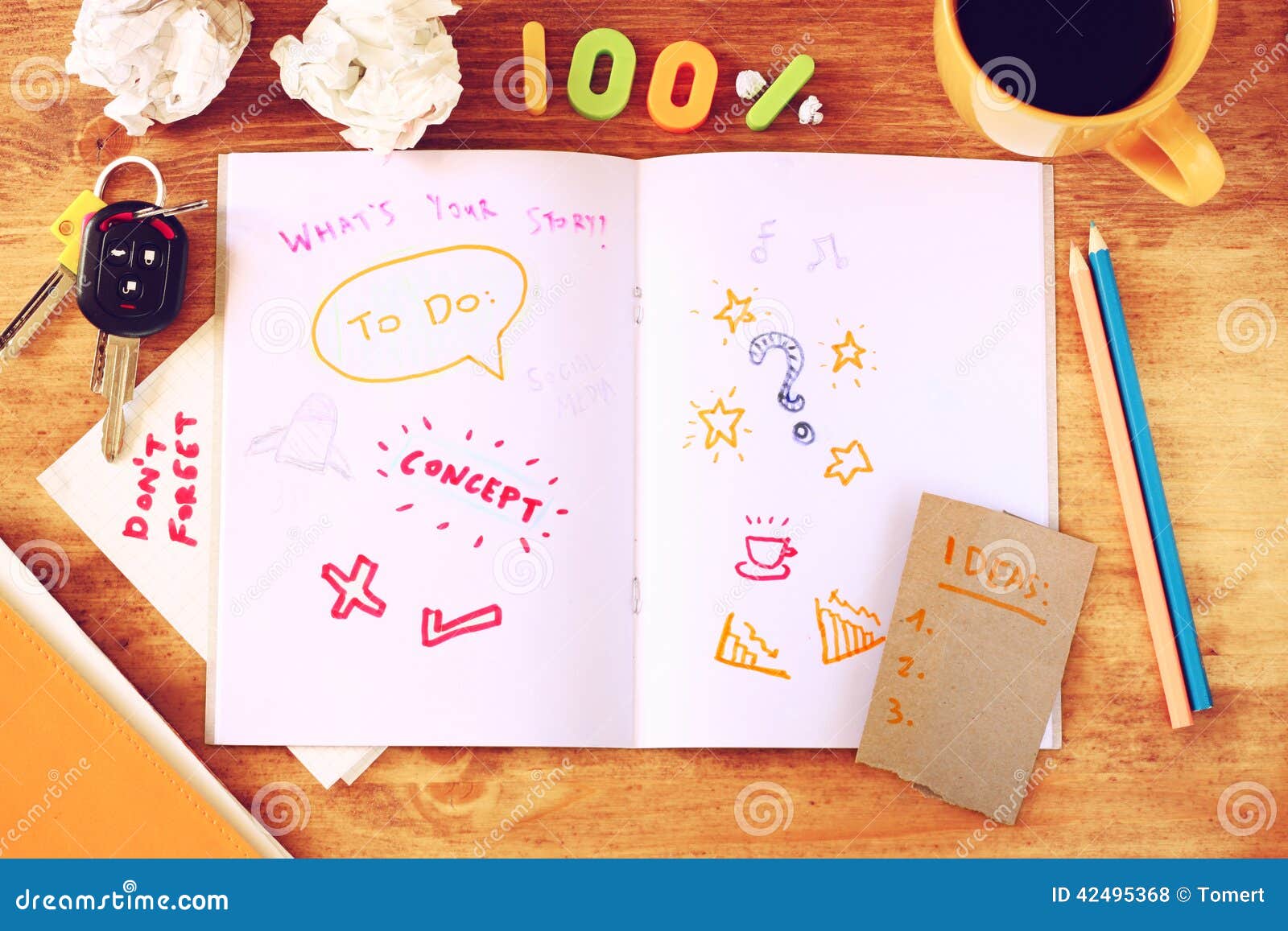 Top View of Messy Table with Notebook with Doodles, Coffee Cup, Papers ...