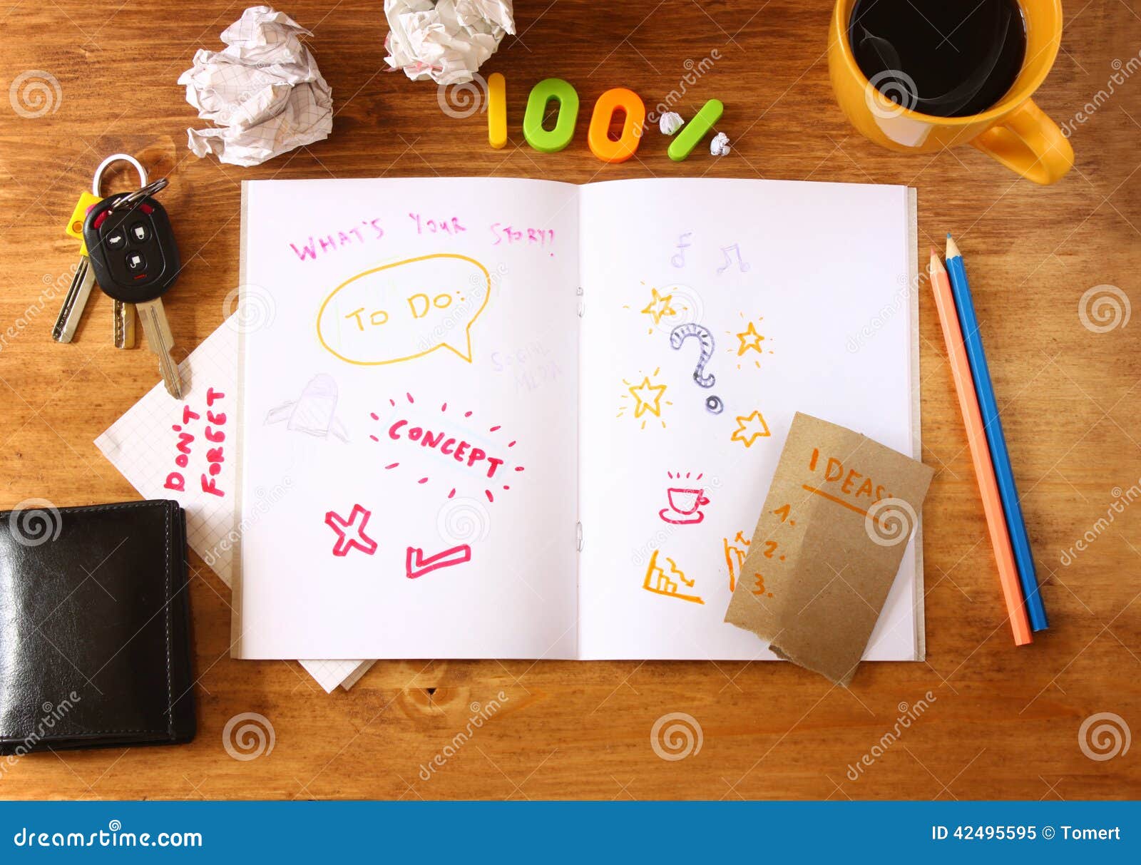 Top View of Messy Table with Notebook with Doodles, Coffee Cup, Papers ...