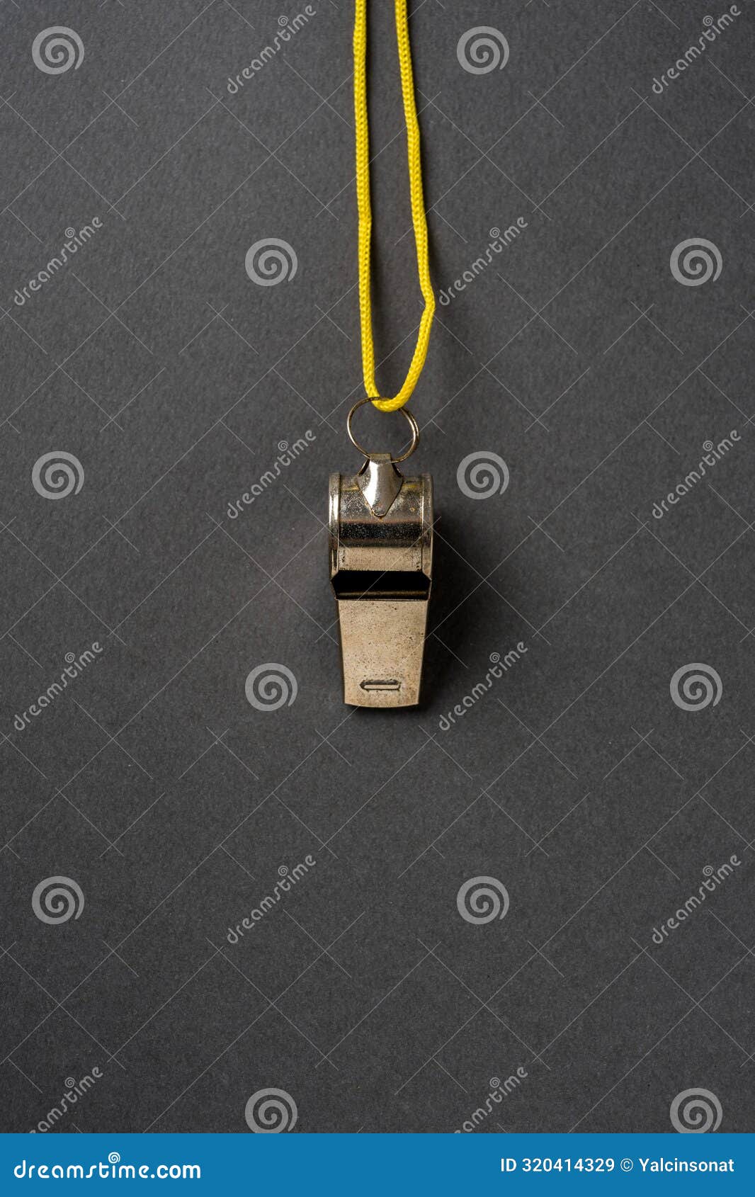 Top View of Metal Whistle with Yellow String on Dark Gray Background ...