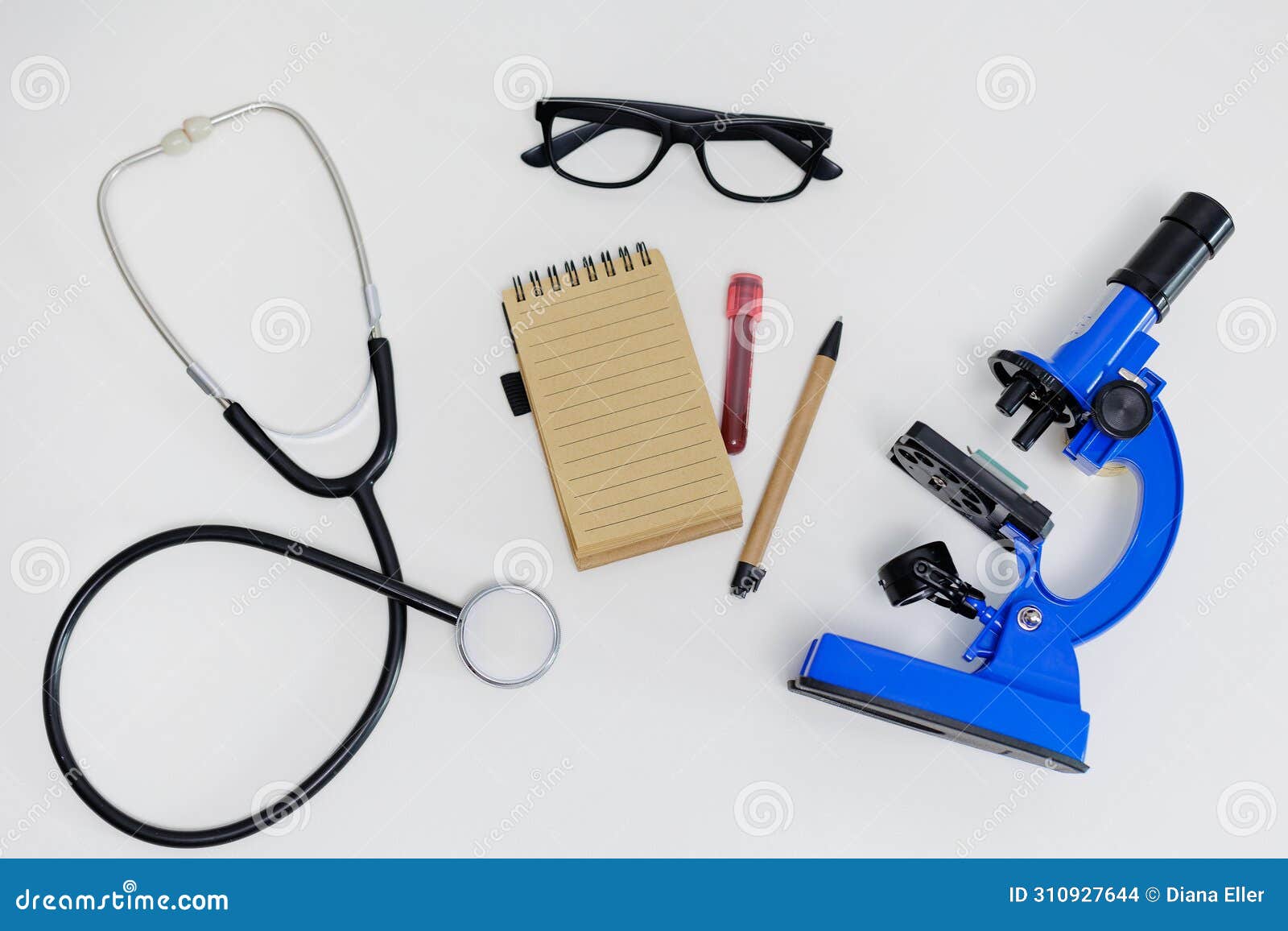 Top View of Microscope, Stethoscope, Eyeglasses and Notebook with Pen ...