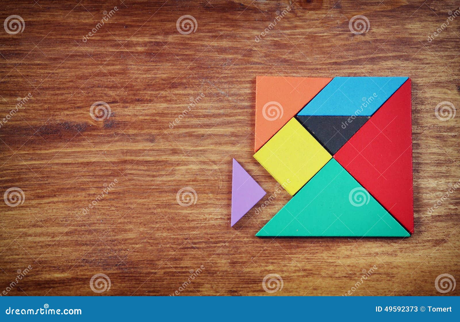 Top View of a Missing Piece in a Square Tangram Puzzle, Over Wooden ...