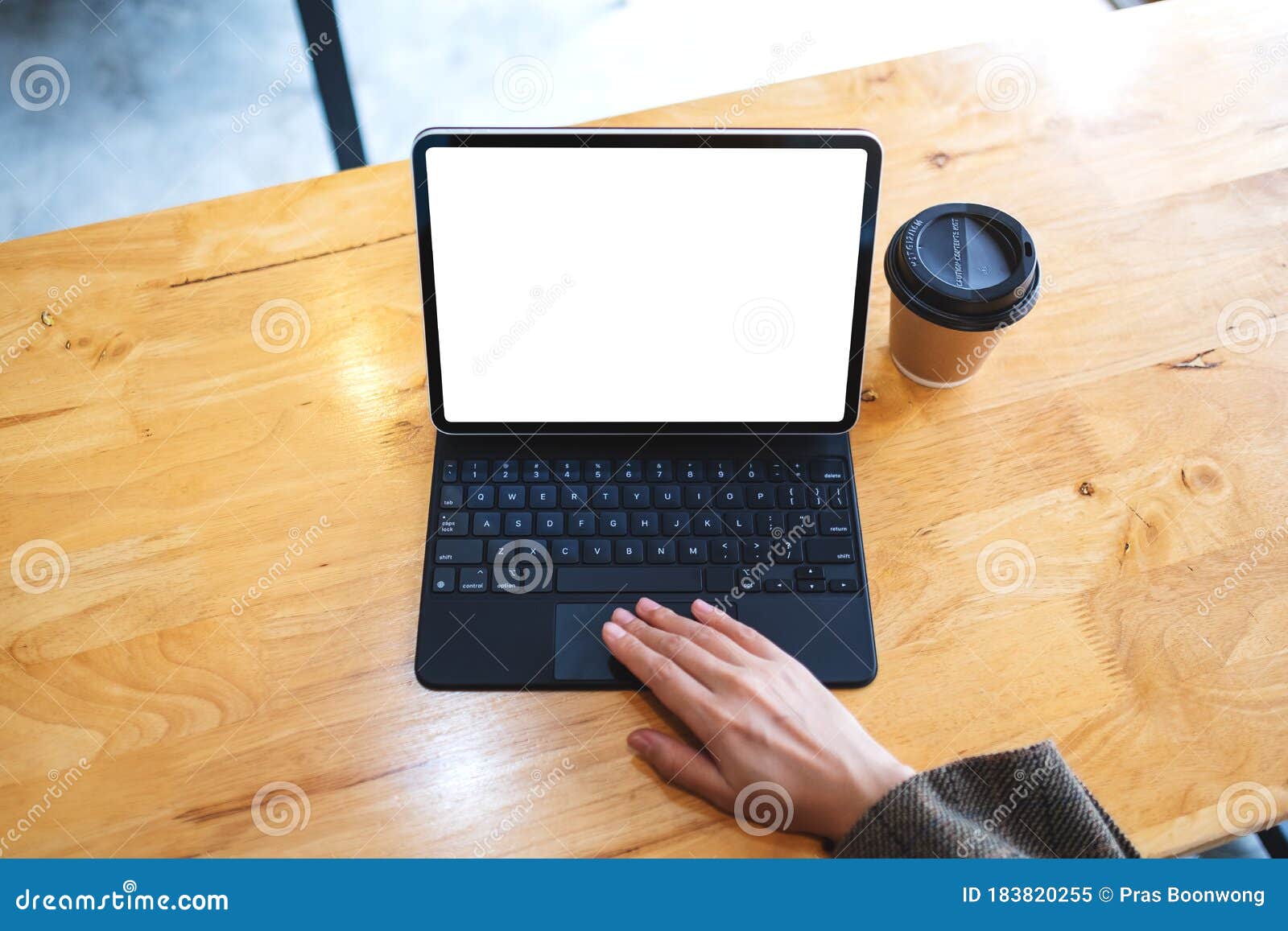 A Hand Using and Touching Tablet Touchpad with Blank White Desktop ...