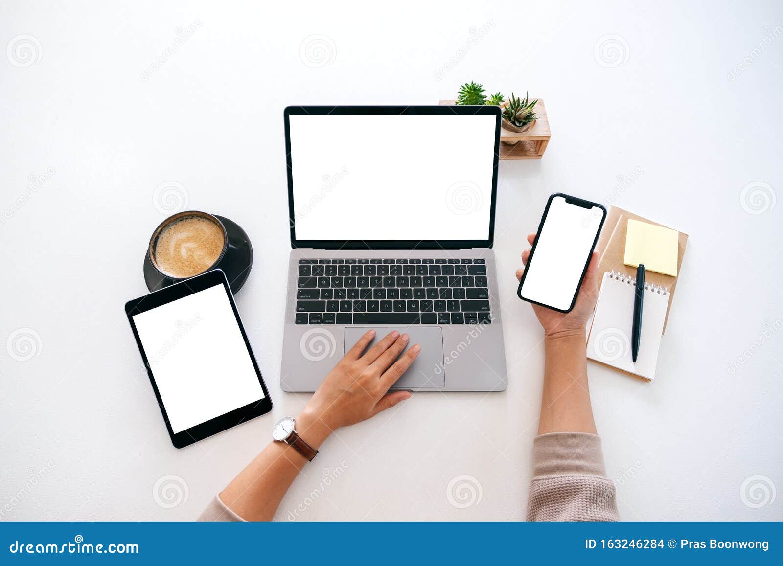 Hands Holding a Blank White Screen Mobile Phone with Laptop Computer ...