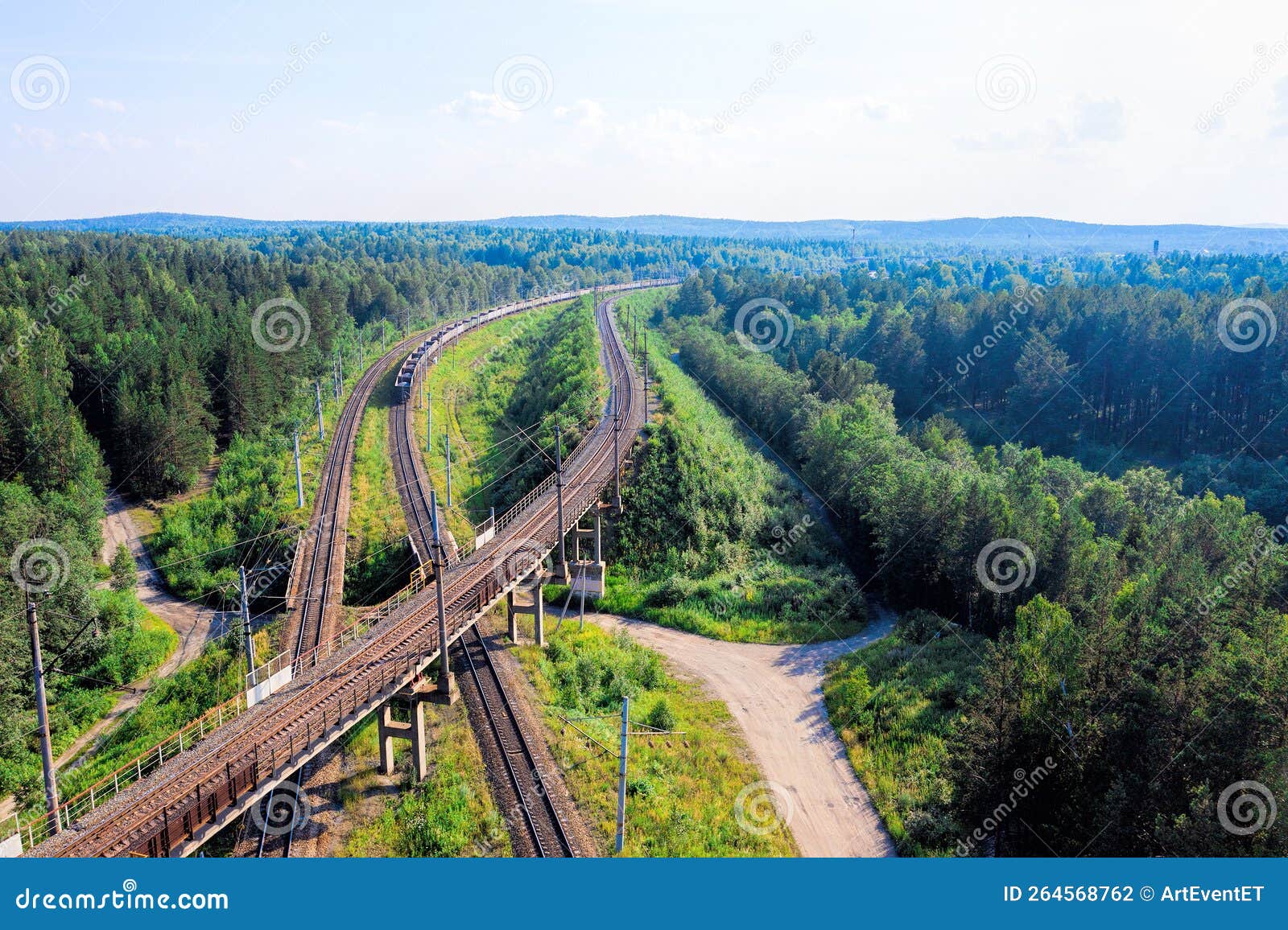 Top View of the Movement of Freight Train on a Railway Overpass on a ...