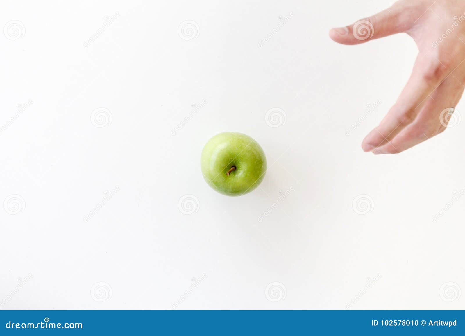 Top View of Moving Left Hand for Grabbing a Green Apple on White ...