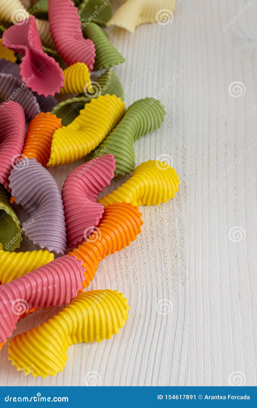 Top View of Multi-colored Pasta on White Wooden Background in ...