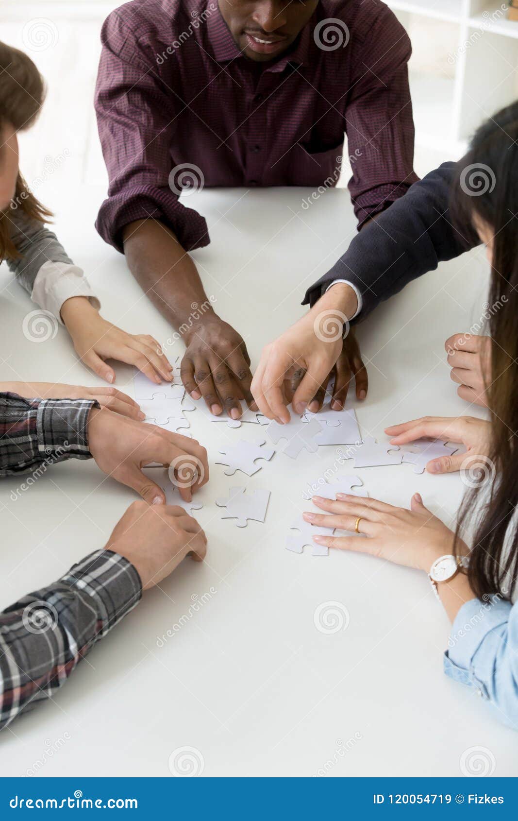 Multiethnic Workers Assembling Jigsaw Puzzle while Teambuilding Stock ...