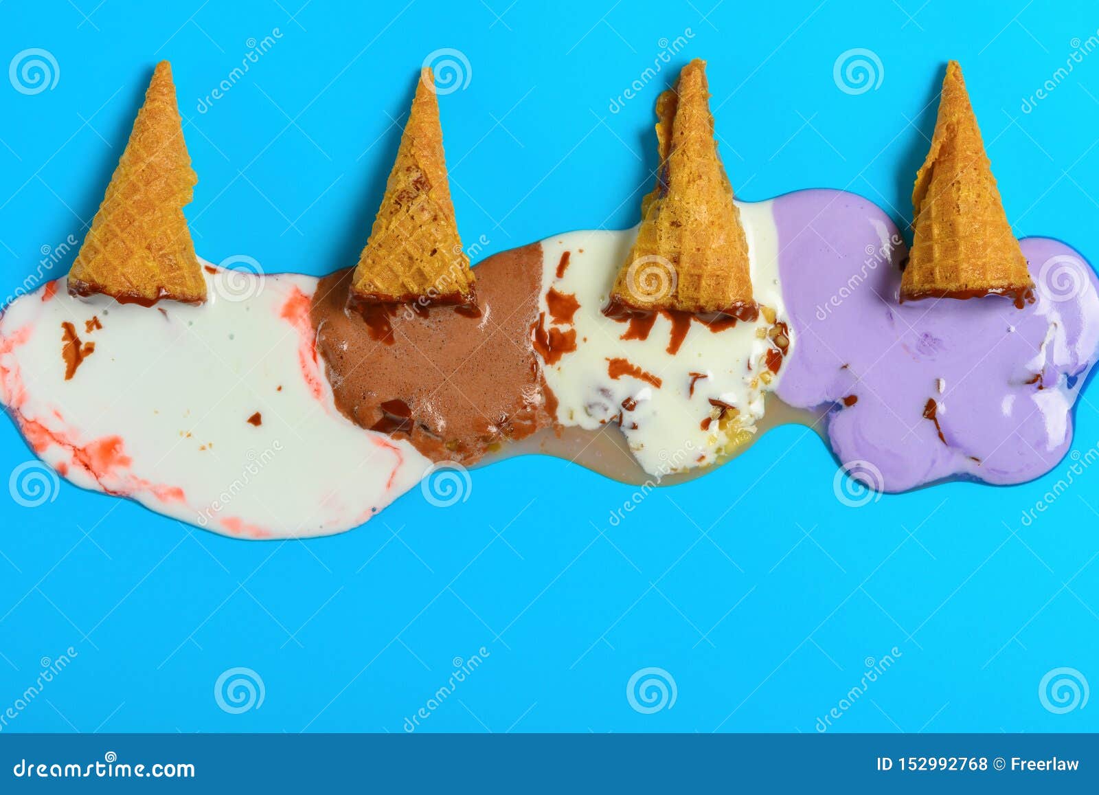 Multiple Flavor Ice Cream Cones Melted On Blue Background Royalty-Free ...