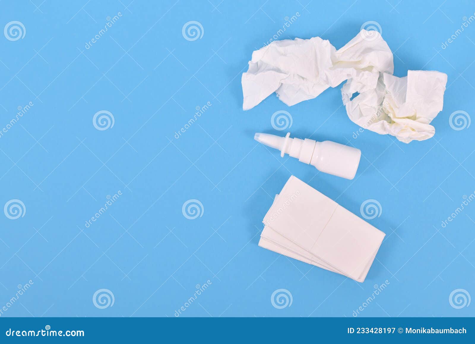 Top View Of Nasal Spray Bottle And Used Tissues Used During Common Cold On Blue Background ...