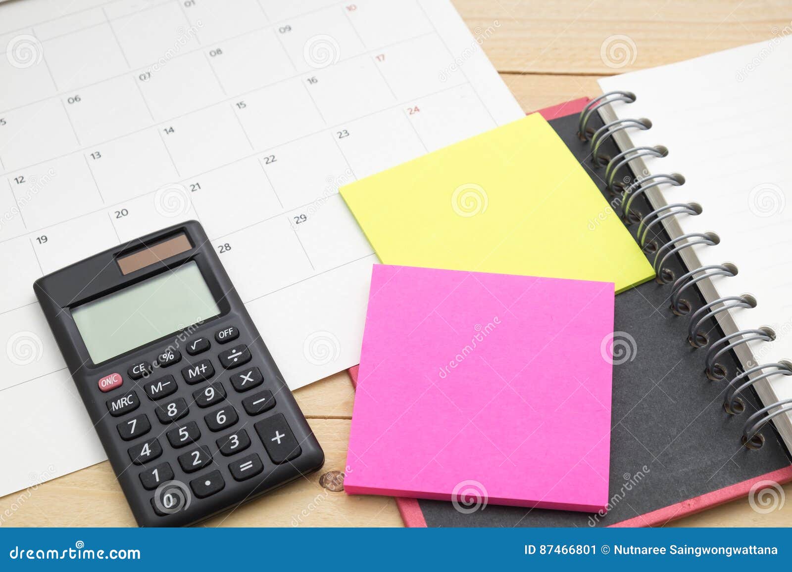 Top View Notebook ,calculator,post it Note and Calendar Put on W Stock ...