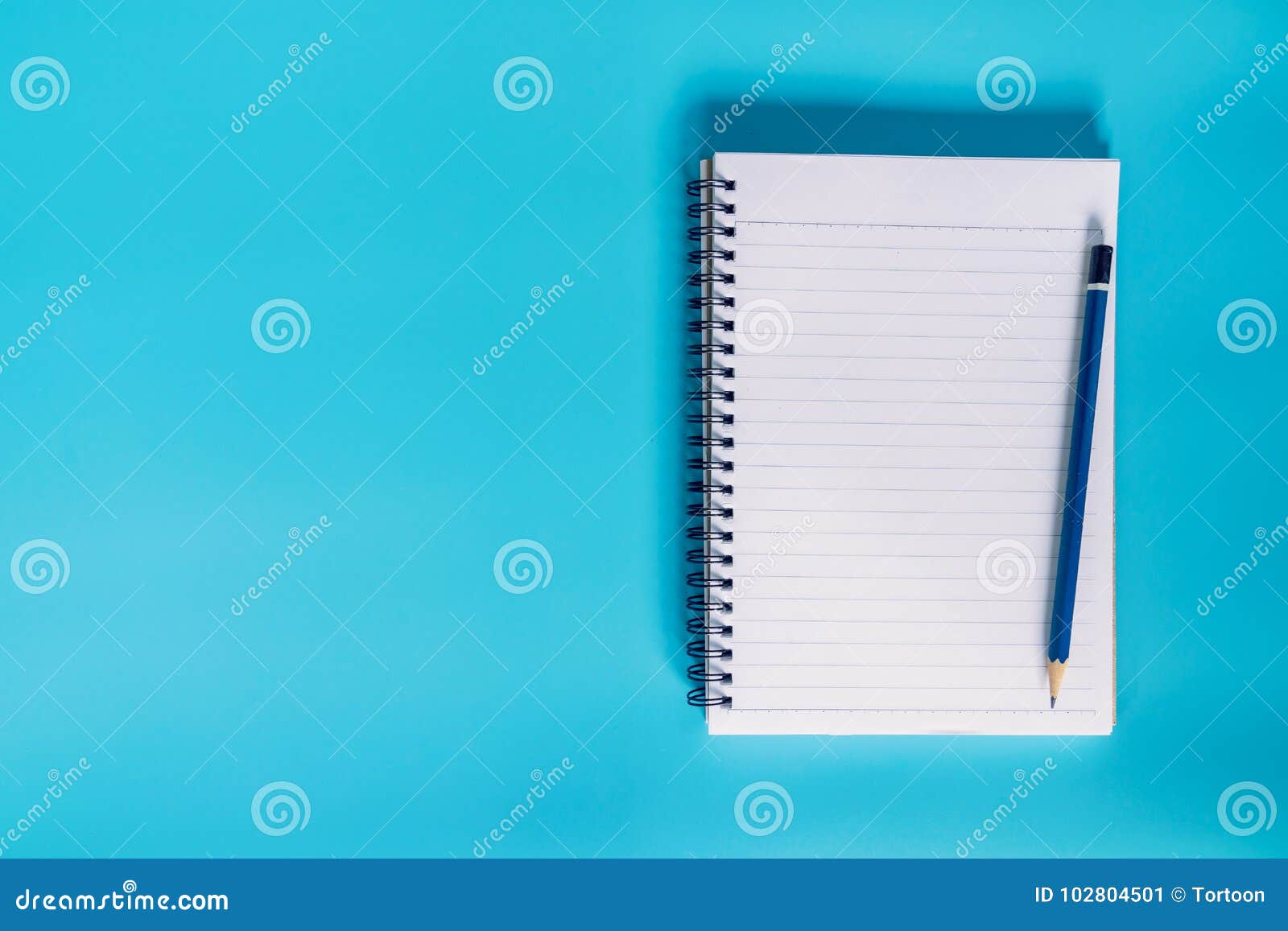 Top View Notebook Paper on Blue Pastel Color Background with Spa Stock ...