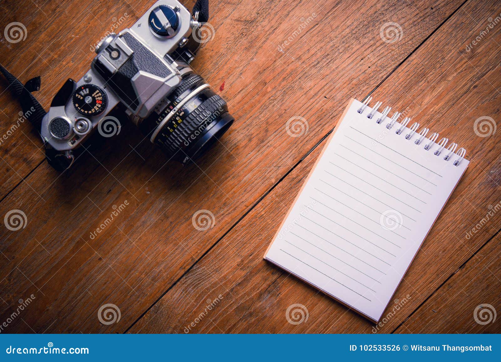 Top View of Notebook Paper and Camera on Office Desk Table. Stock Photo ...